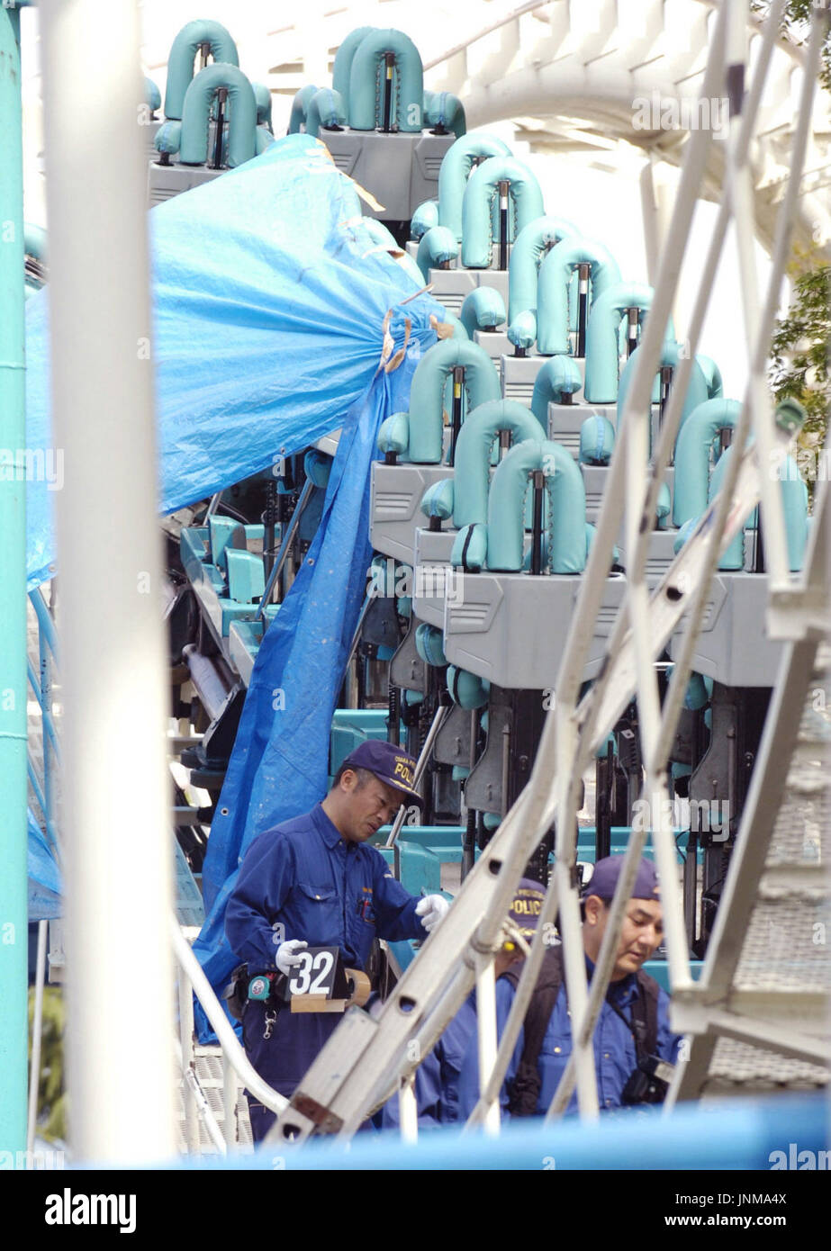 OSAKA, Japan - Police investigators check the roller coaster at ...