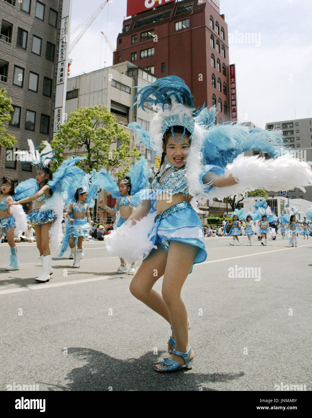 KOBE, Japan - A samba dancer performs in a parade, the main event of ...