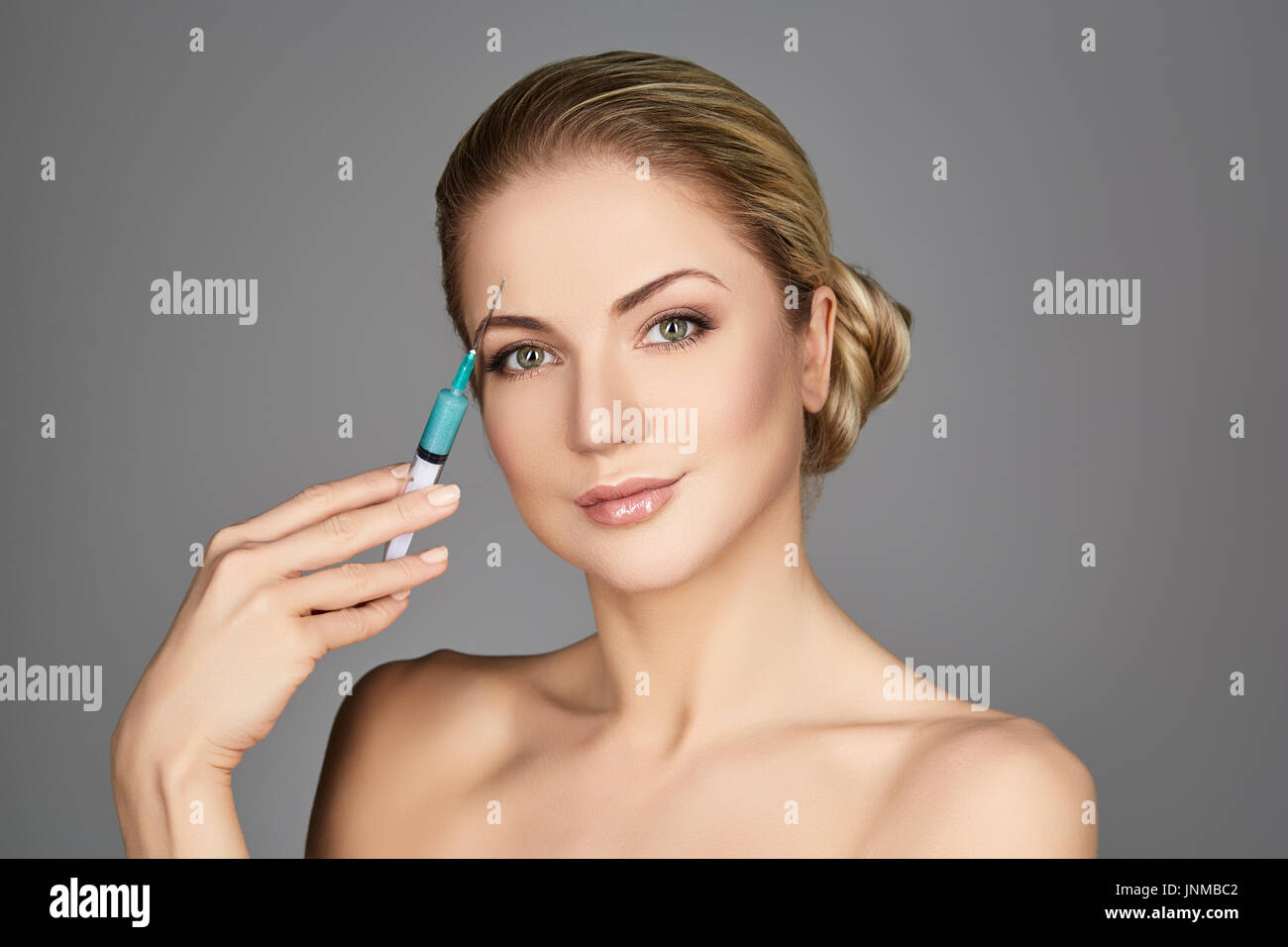 beautiful girl holding syringe Stock Photo - Alamy