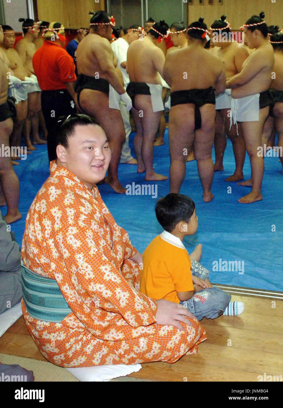 TOKYO, Japan - New yokozuna Hakuho from Mongolia (L, front) watches ...
