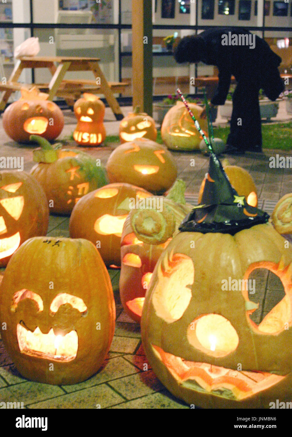 NANAE, Japan - Thirty-five jack-o'-lanterns glow in front of JR Onuma ...