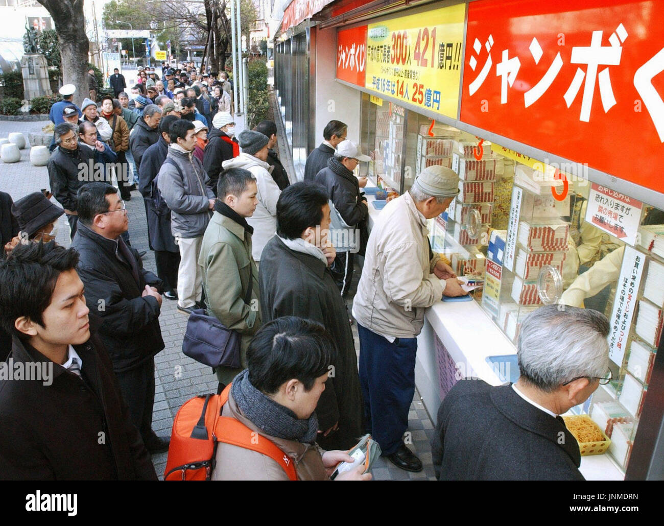 TOKYO, Japan - People line up in Tokyo's Ginza district on Feb. 13 to ...