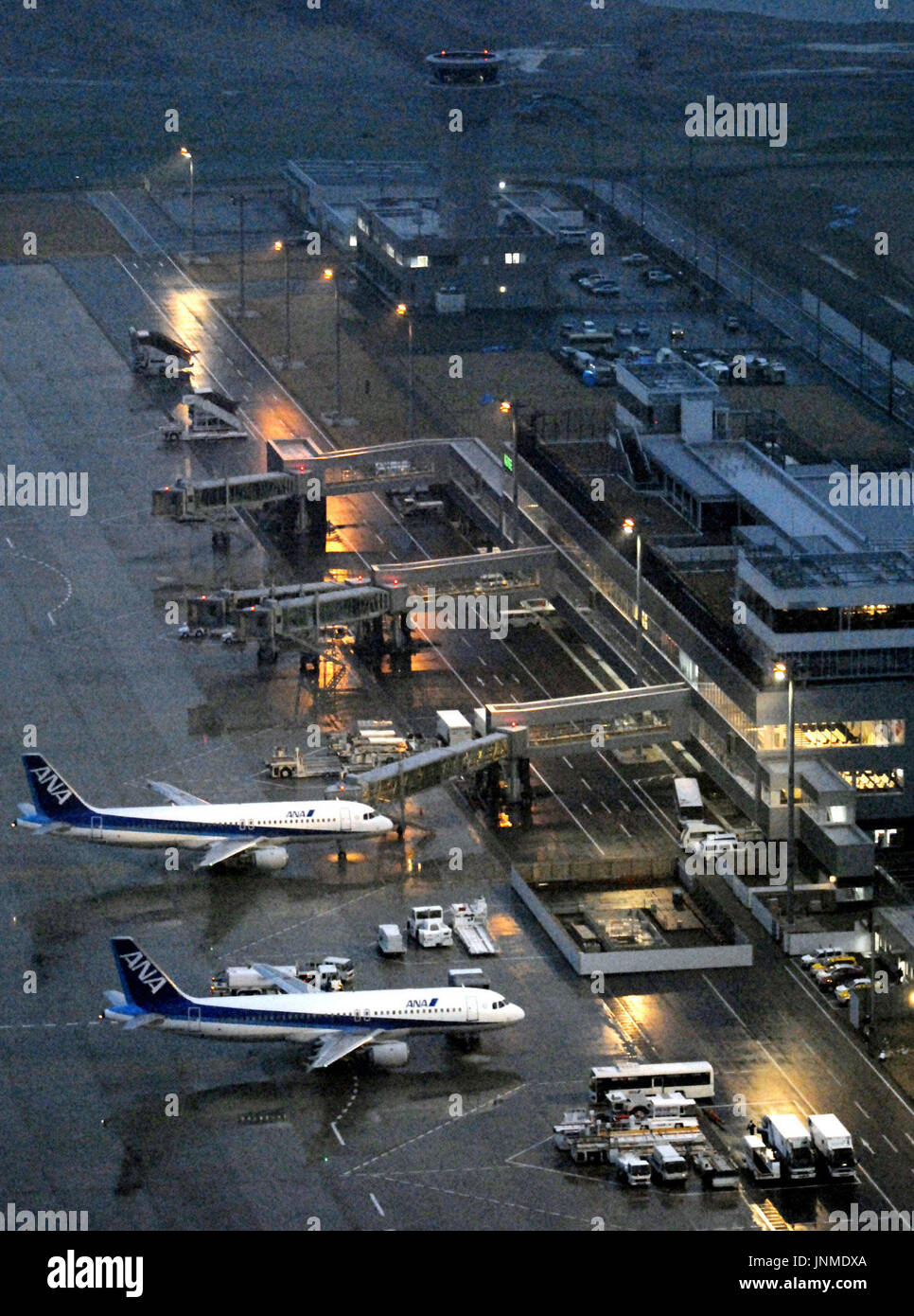 KOBE, Japan - Jetliners stand parked at the newly completed Kobe ...