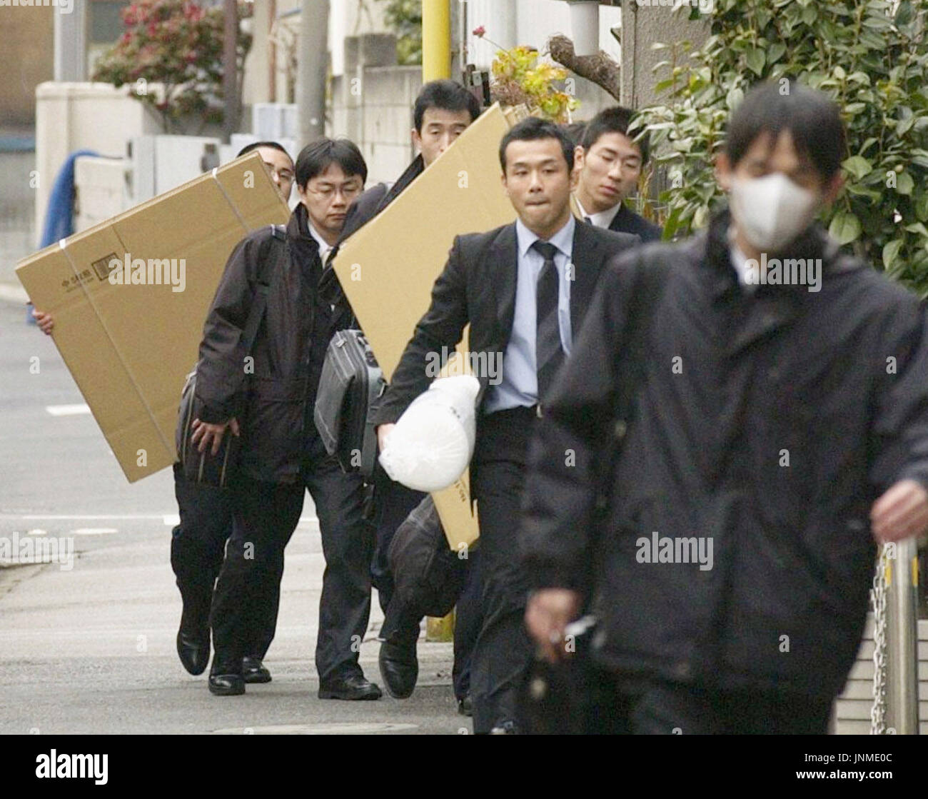 TOKYO, Japan - Japanese police head for a search at the office of ...