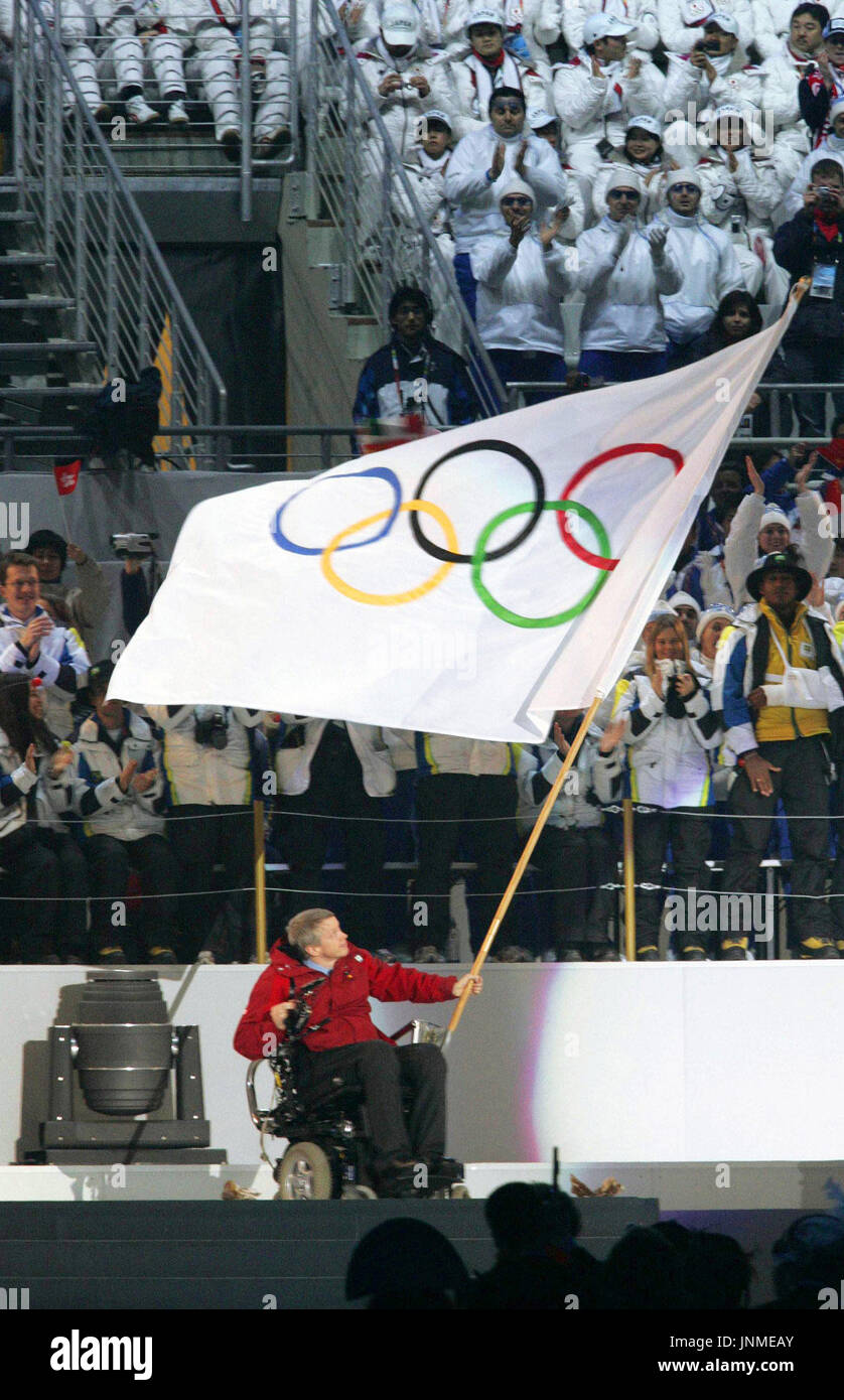 TURIN, Italy - Sam Sullivan, the mayor of Vancouver, the next Winter Olympics venue, waves the ...