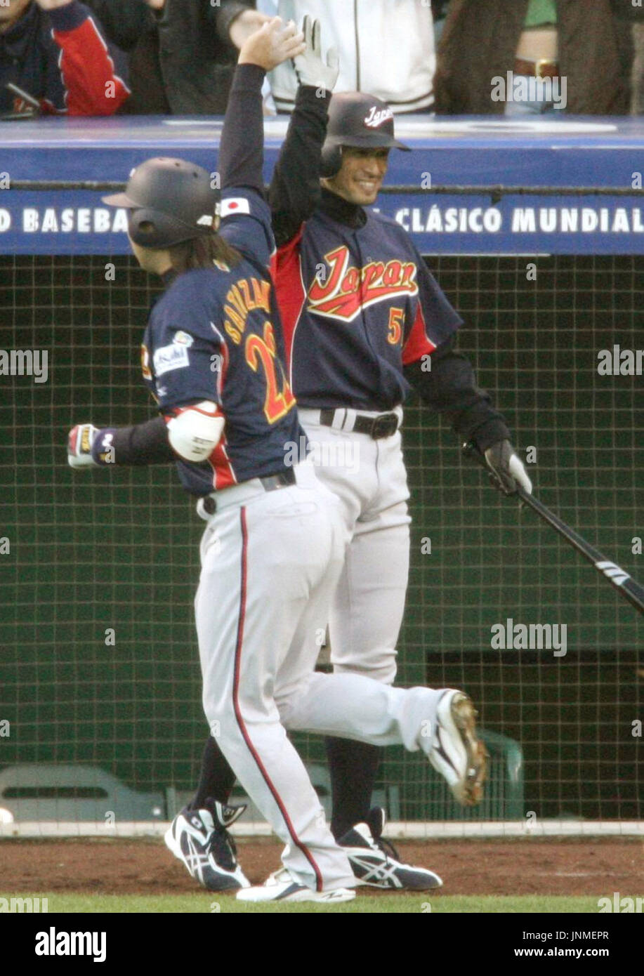 ANAHEIM, United States - Team Japan catcher Tomoya Satozaki (L) gets ...