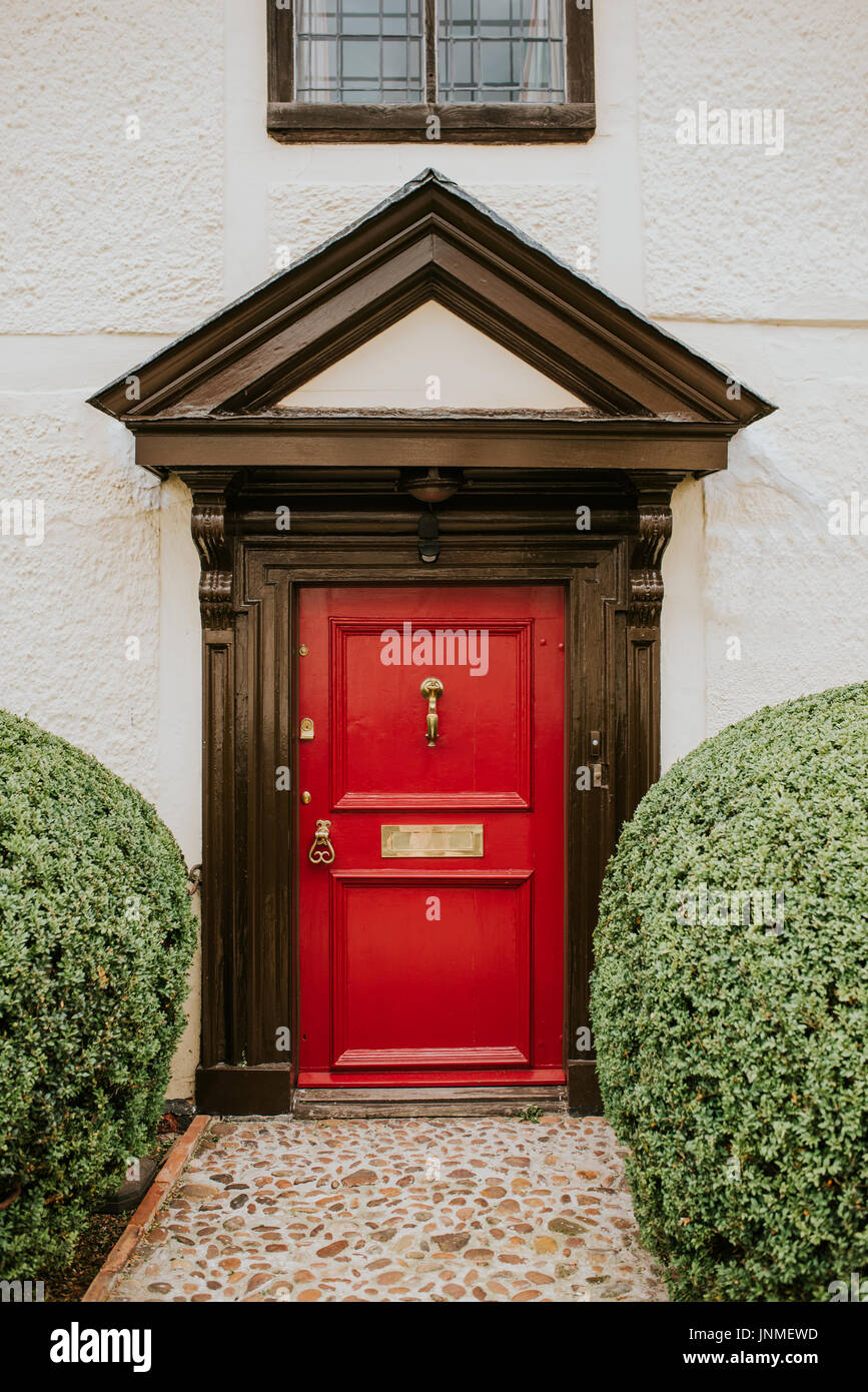 Classic red wooden door in England Stock Photo - Alamy
