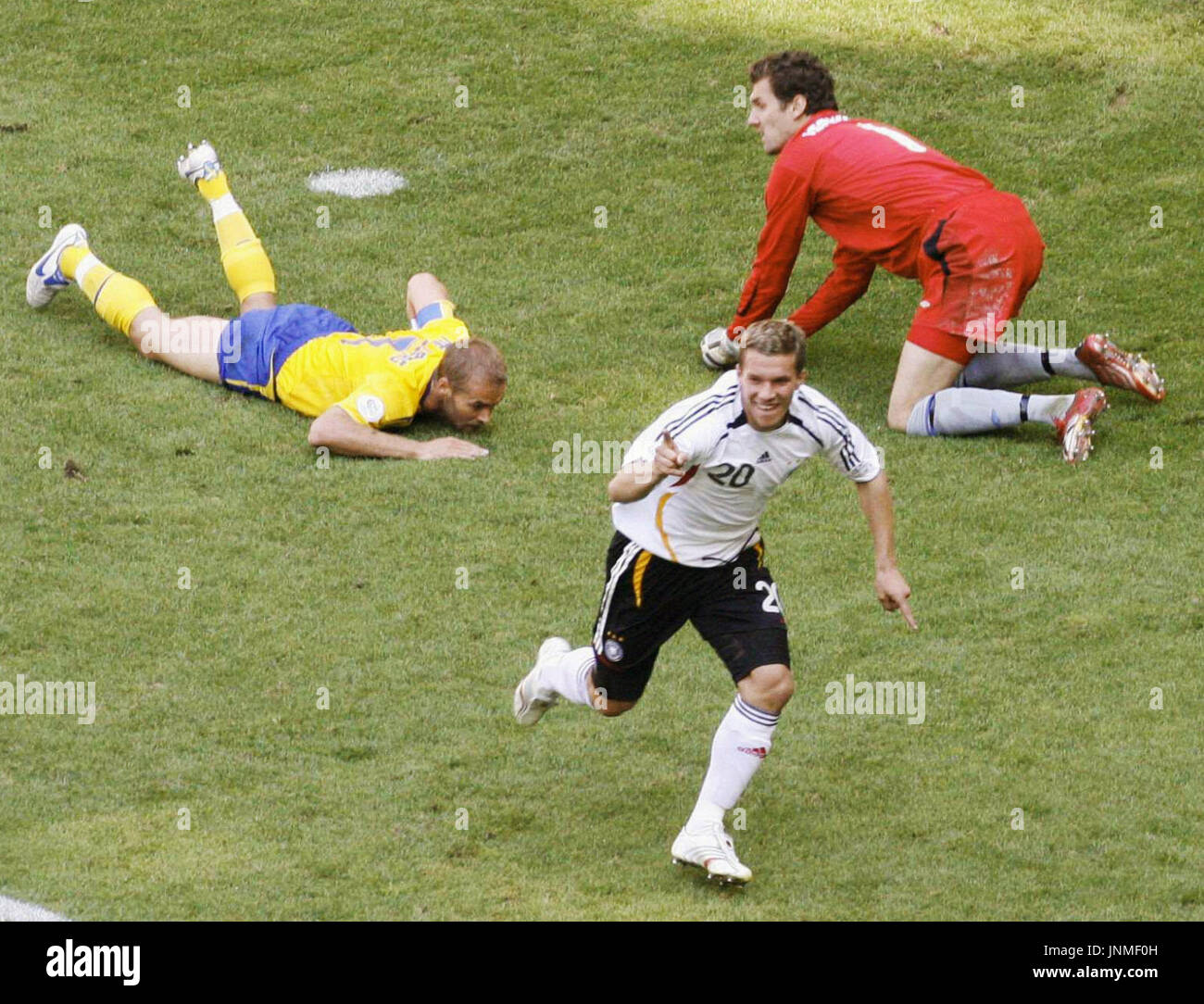MUNICH, Germany - Germany striker Lukas Podolski (fore) runs in ...