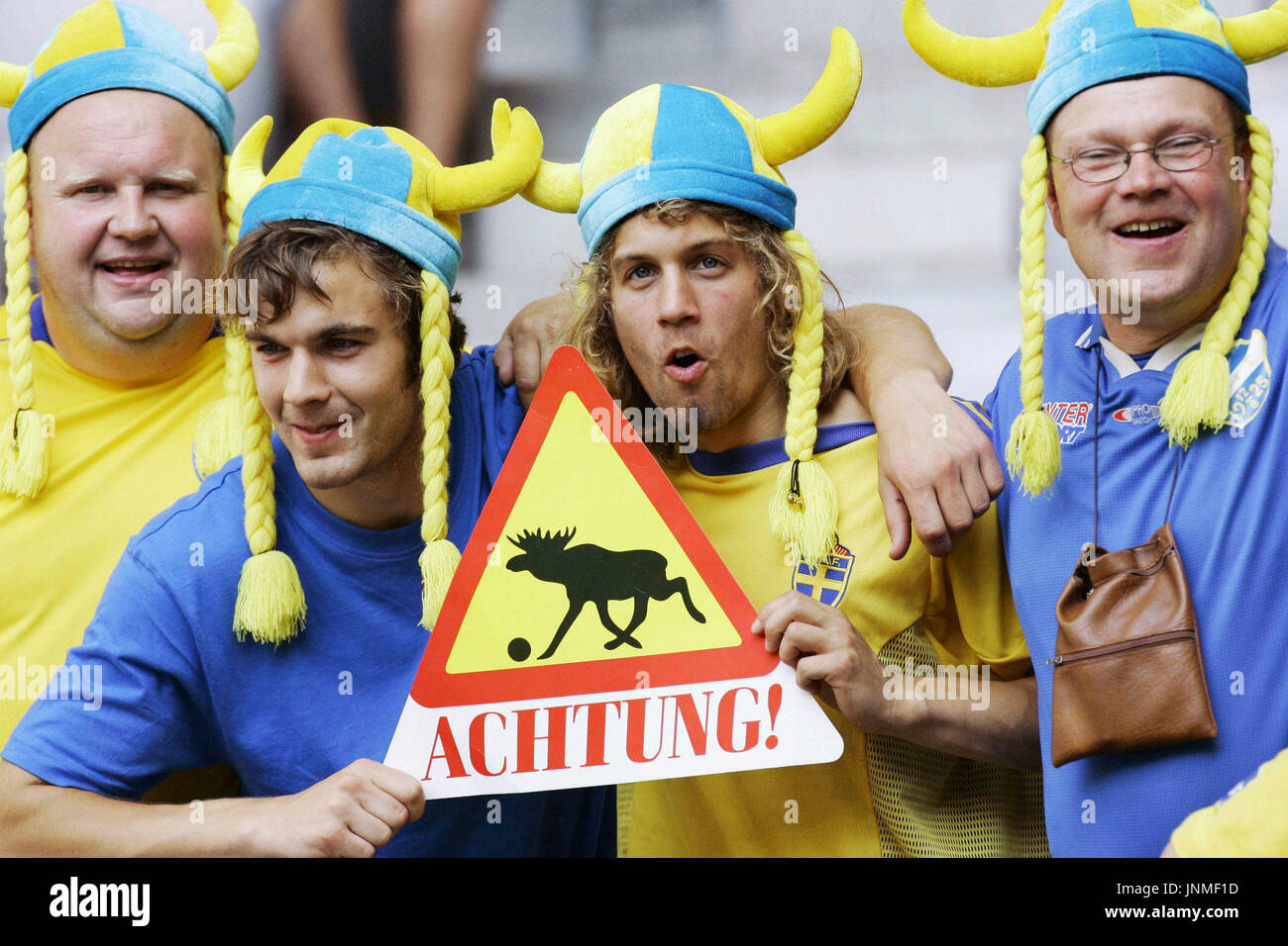 MUNICH, Germany - Sweden supporters pose for a photo as they wait for ...