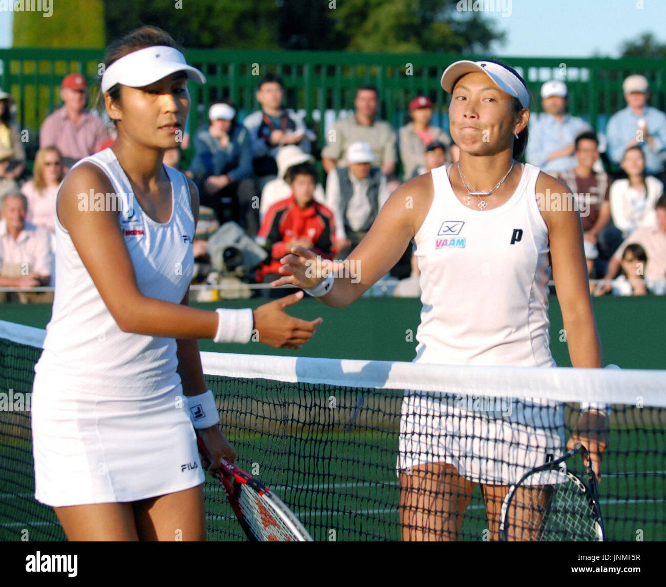 WIMBLEDON, England - Japan's Akiko Morigami (L) and Ai Sugiyama shake ...