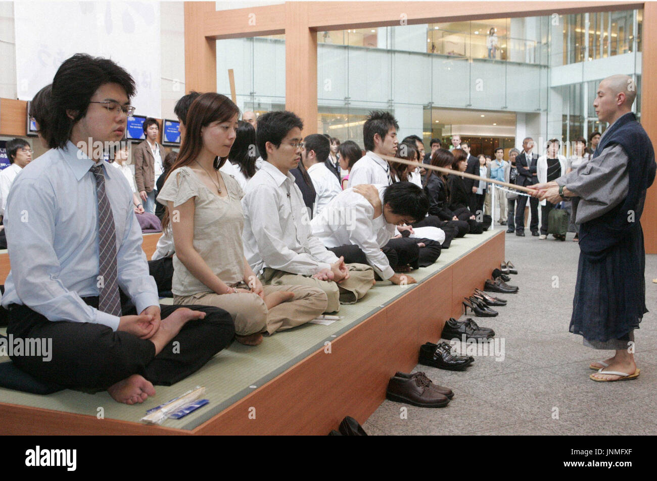 TOKYO, Japan - Participants keep Zen meditation posture to quiet their ...