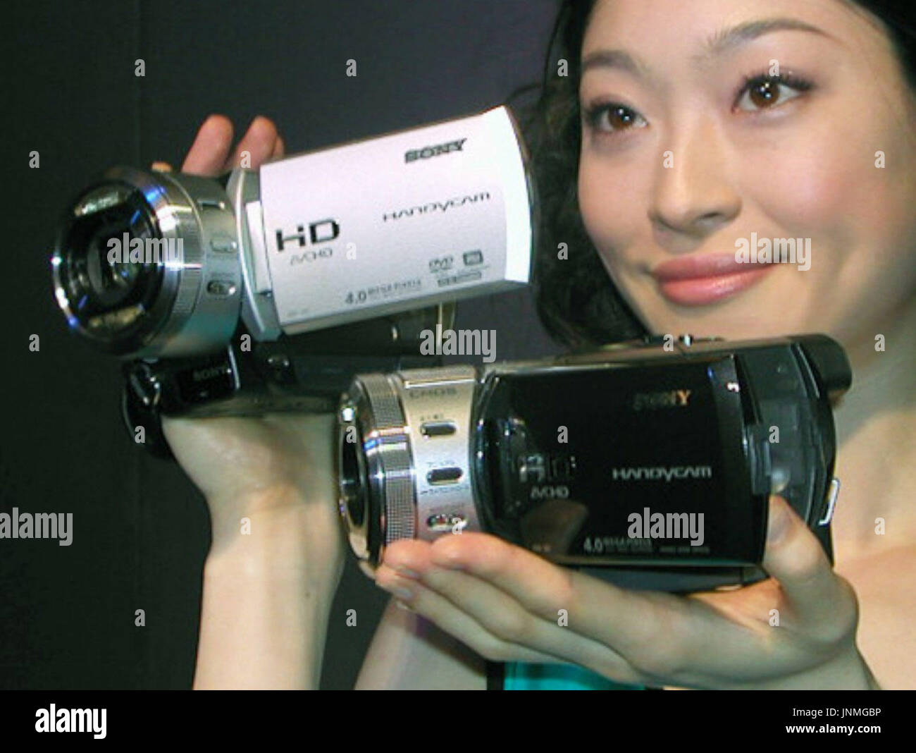 TOKYO, Japan - A marketing assistant shows off a new high-definition ...