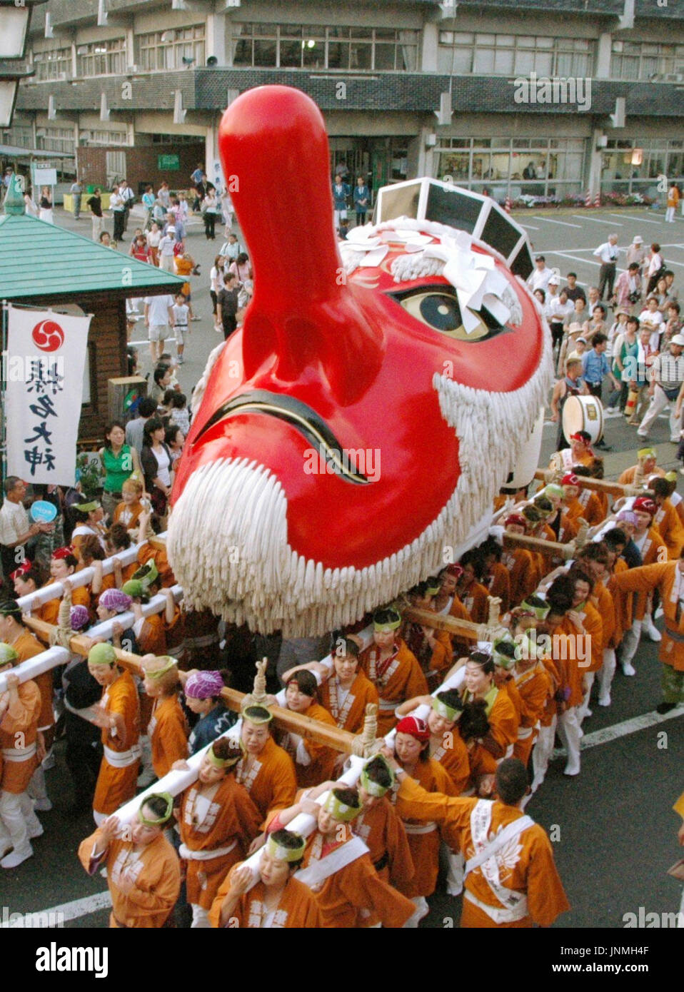 NUMATA, Japan - Women carry a giant mask depicting a Japanese long-nose ...