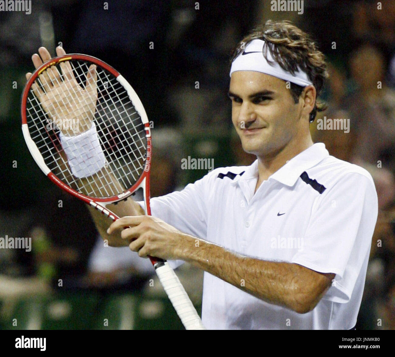 TOKYO, Japan - Roger Federer of Switzerland reacts after beating Wesley ...