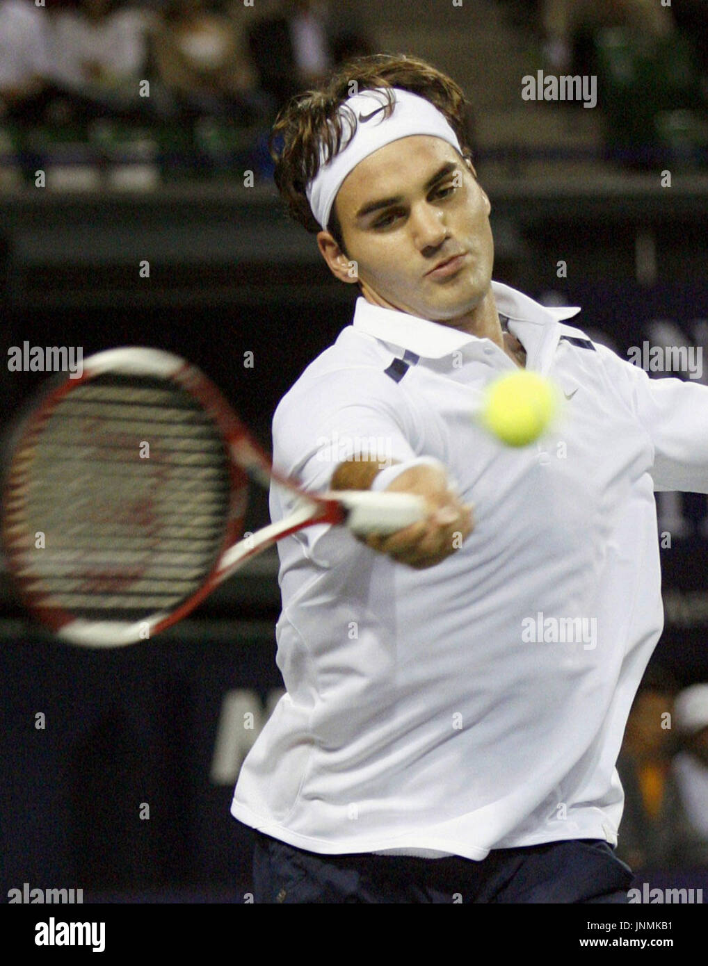 TOKYO, Japan - Roger Federer of Switzerland returns the ball against ...