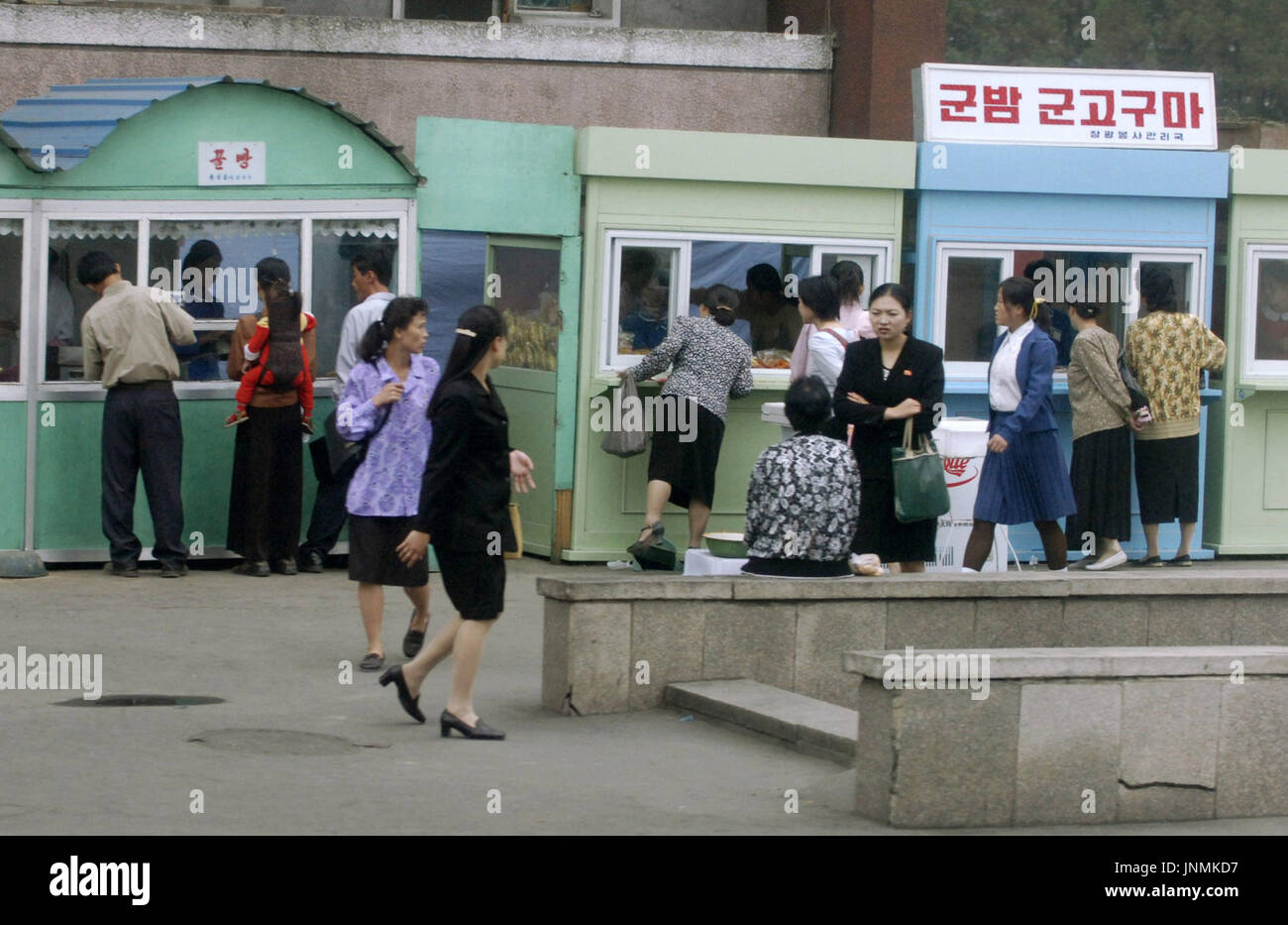 PYONGYANG, North Korea - Citizens shop at stalls in Pyongyang as usual ...
