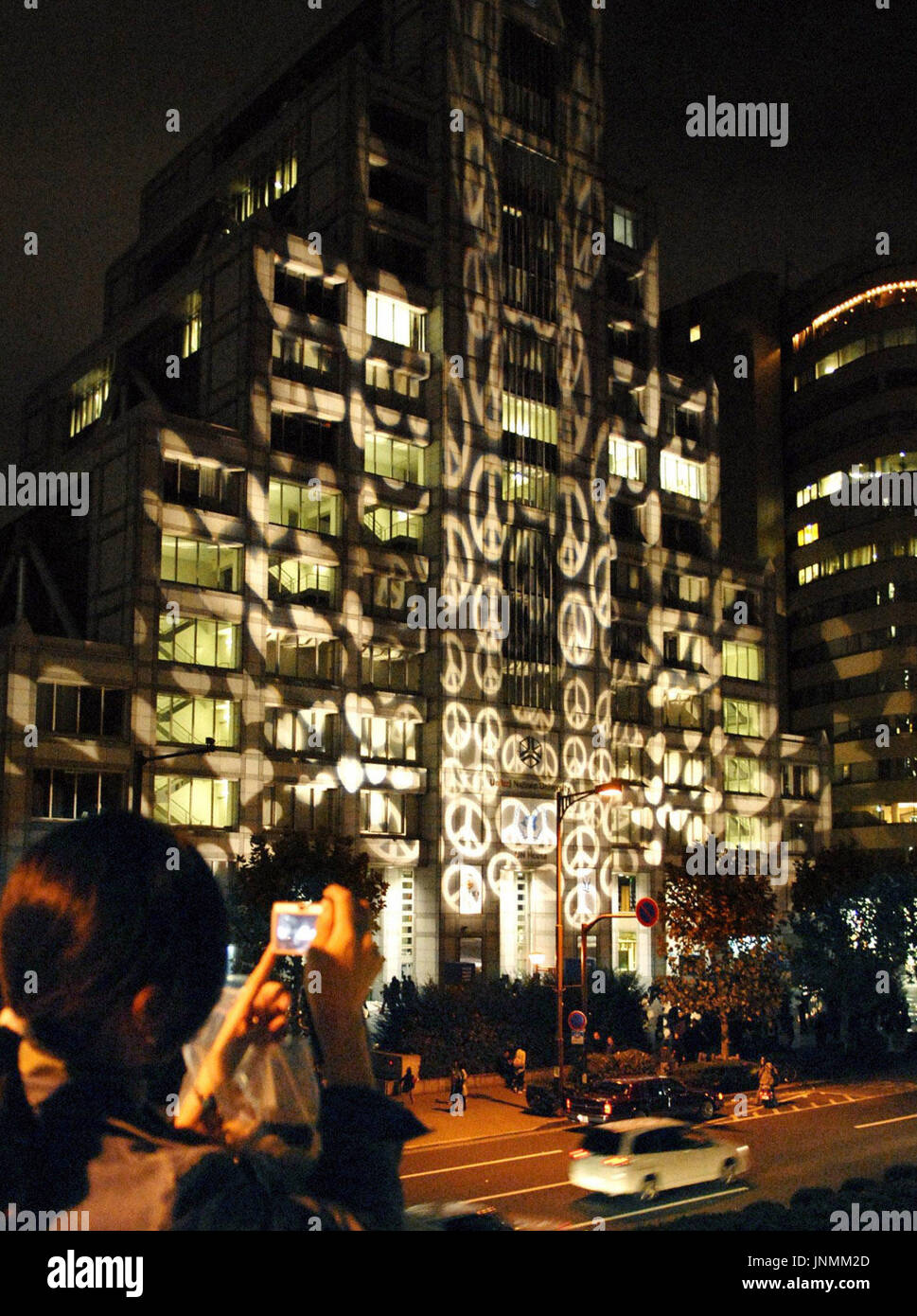 TOKYO, Japan - Illuminated peace symbols adorn the United Nations ...