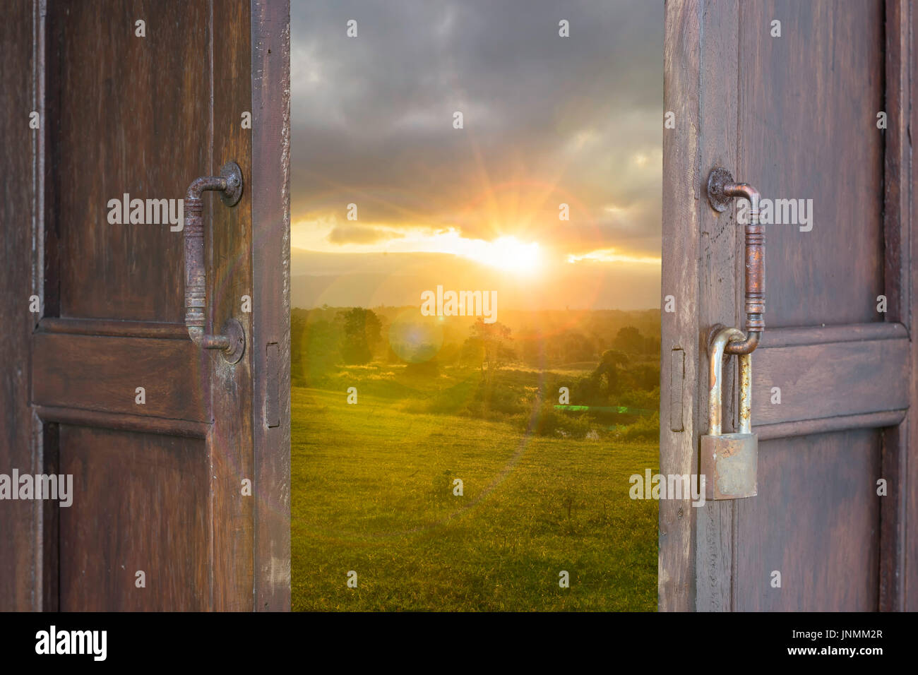 abstract old wood window open to landscape sun light filter and len ...