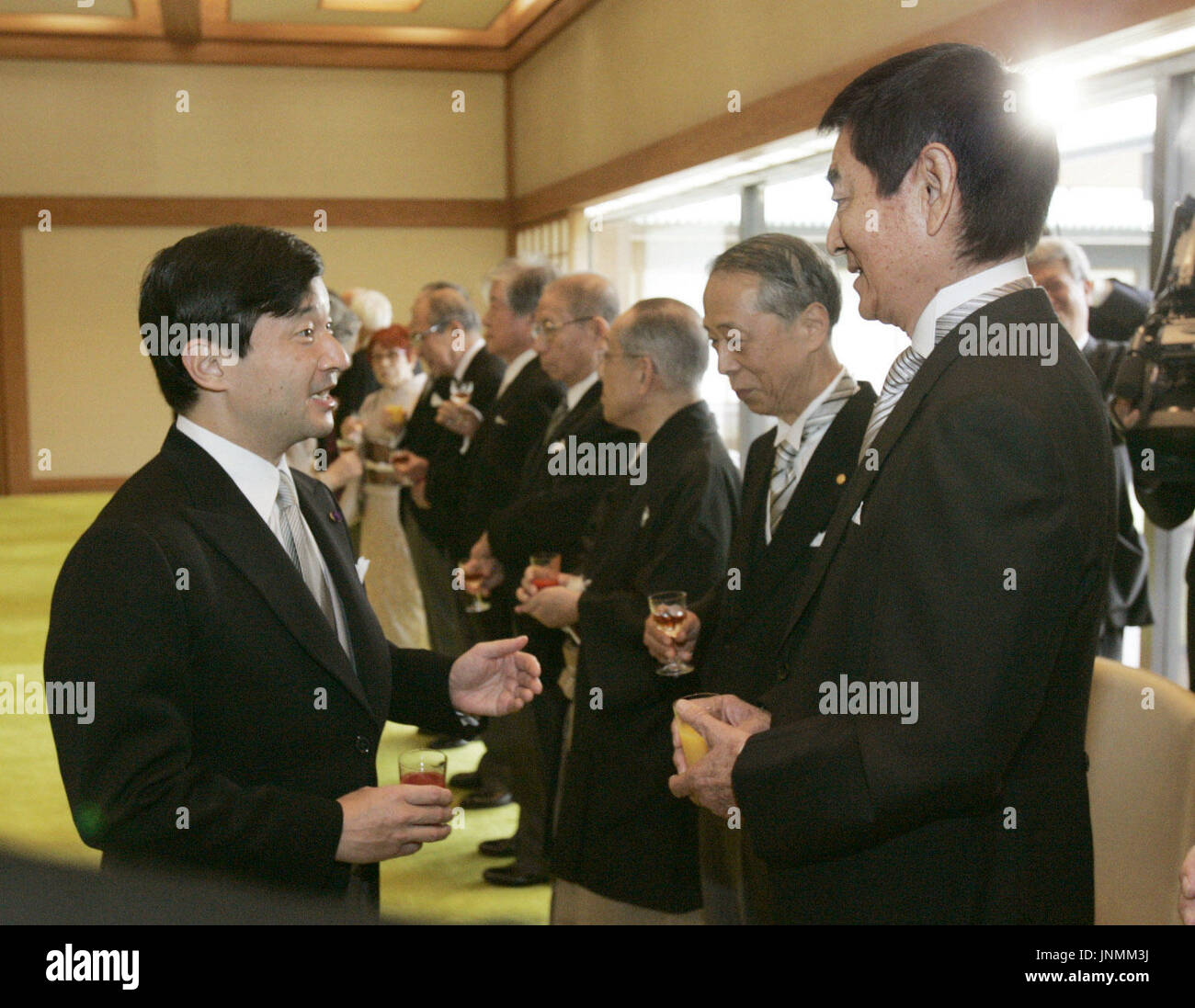 TOKYO, Japan - Crown Prince Naruhito (L) talks with actor Ken Takakura ...