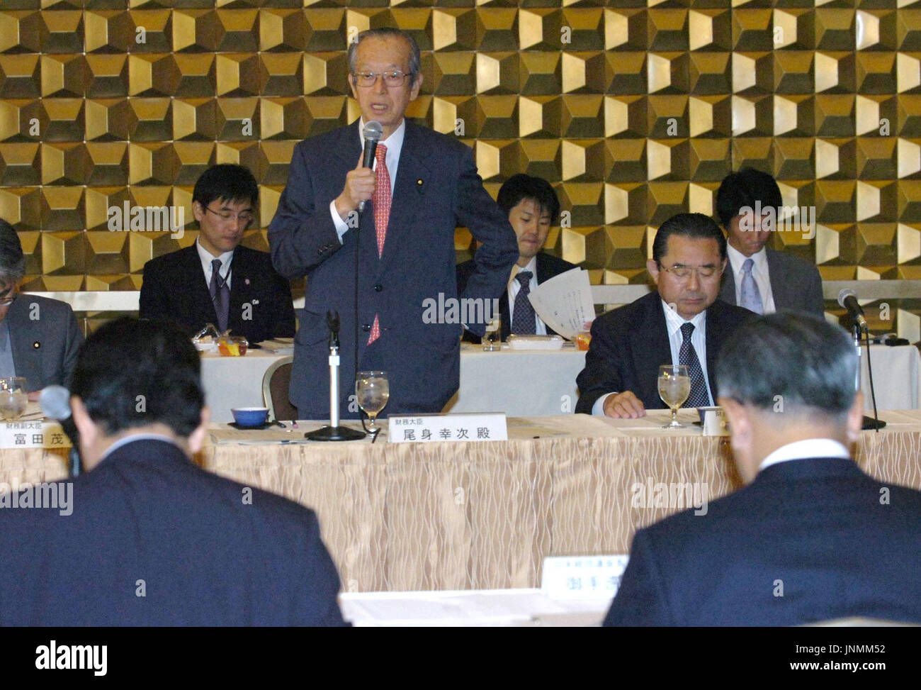 TOKYO, Japan - Finance Minister Koji Omi (standing) addresses a meeting ...