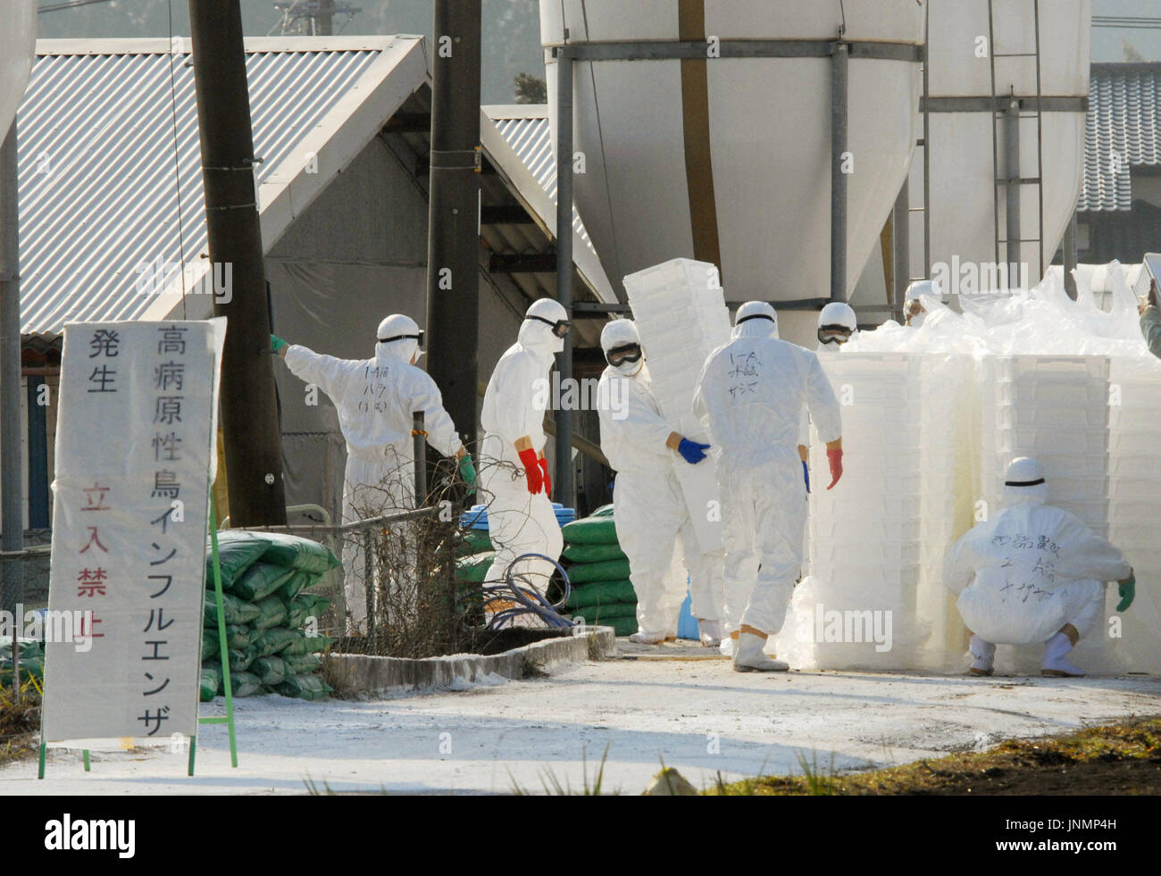 KIYOTAKE, Japan - Sanitation workers bring in plastic containers in ...