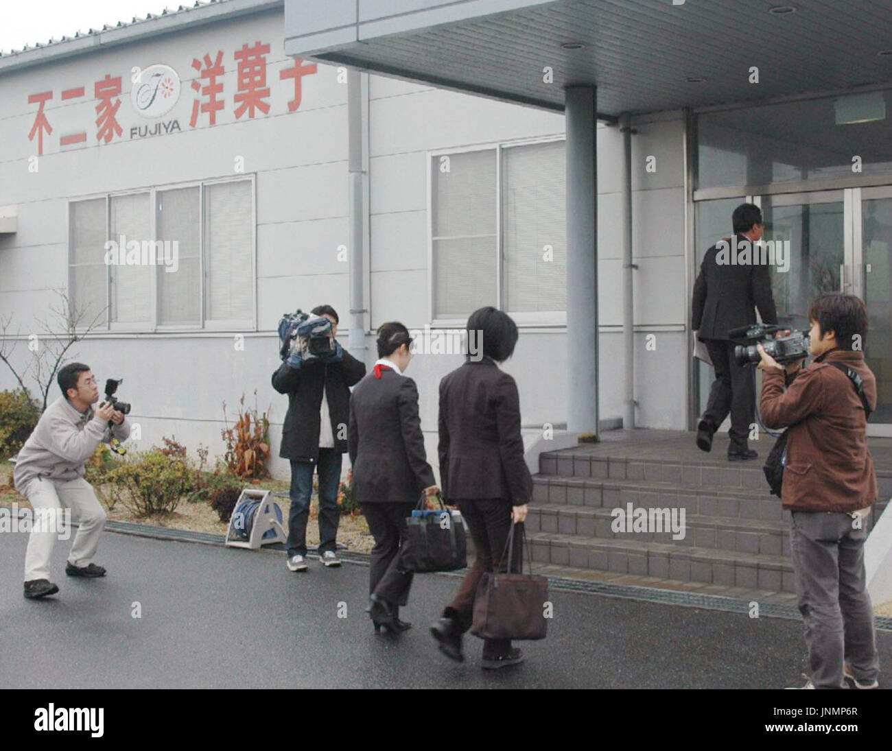 SAGA, Japan - Sanitation officials walk into the Kyushu factory of ...