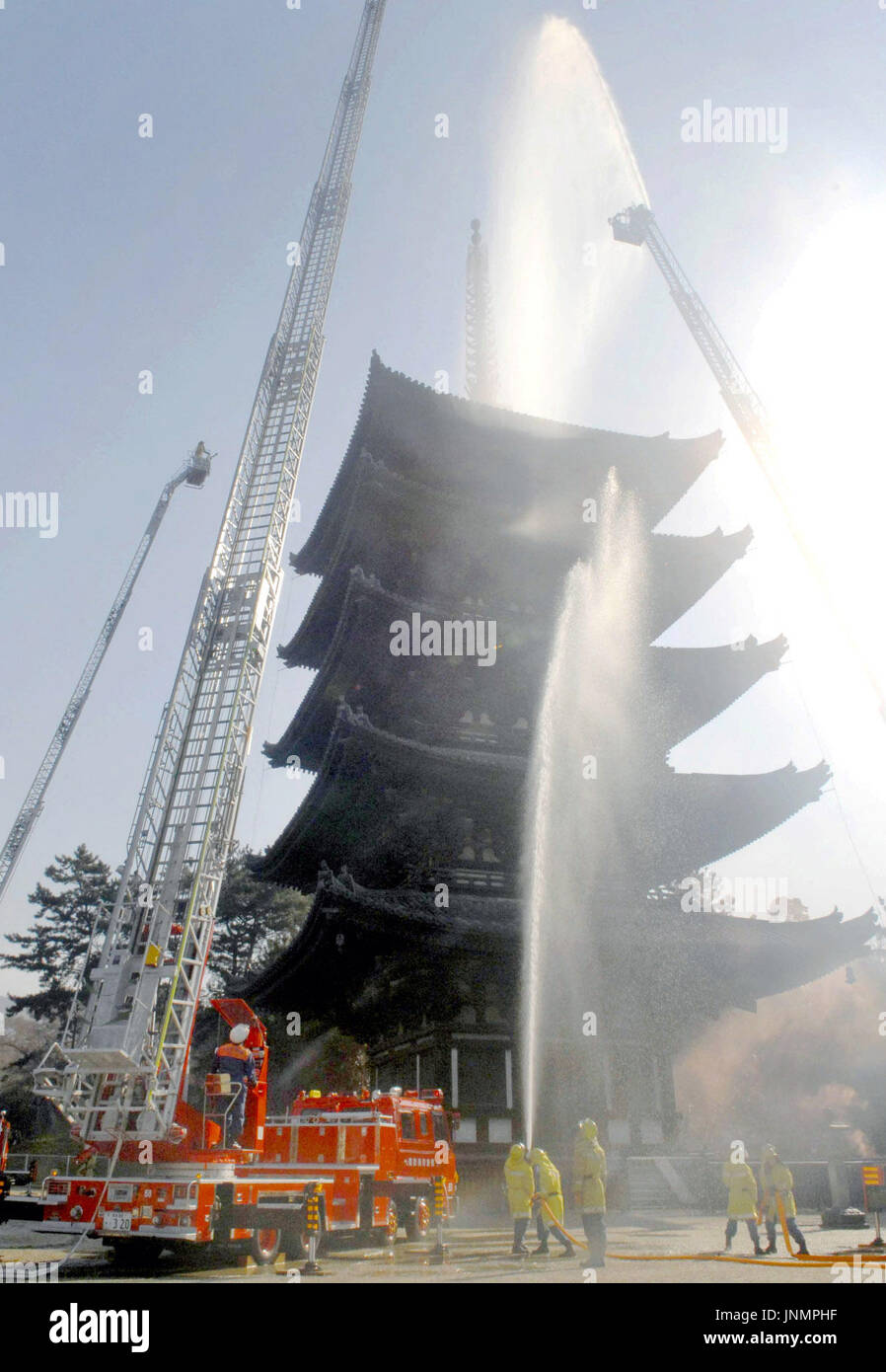 NARA, Japan - Fire fighters pump water to the five-storied pagoda of ...