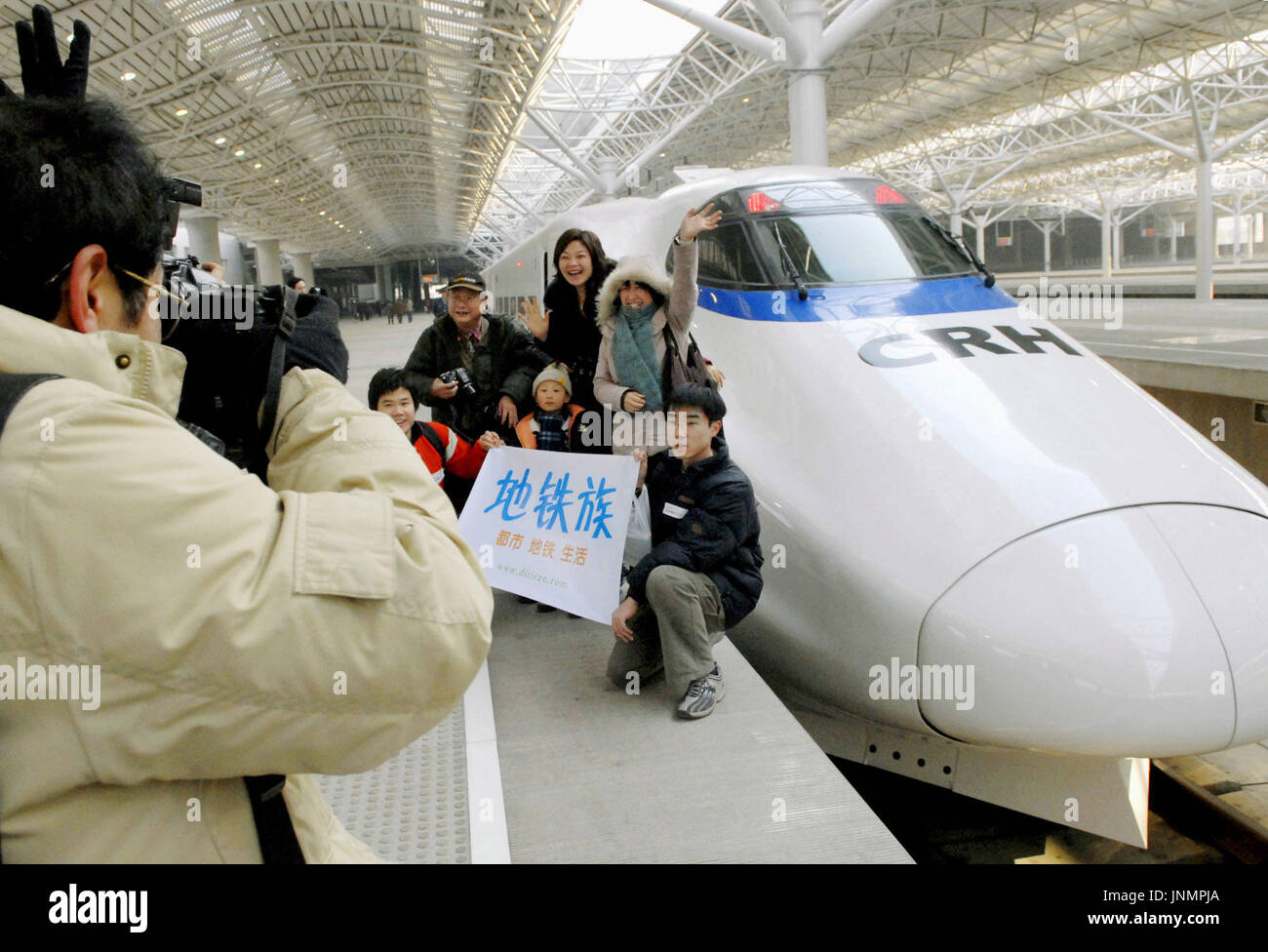SHAGHAI, China - Passengers take photos in front of the CRH2 high-speed ...