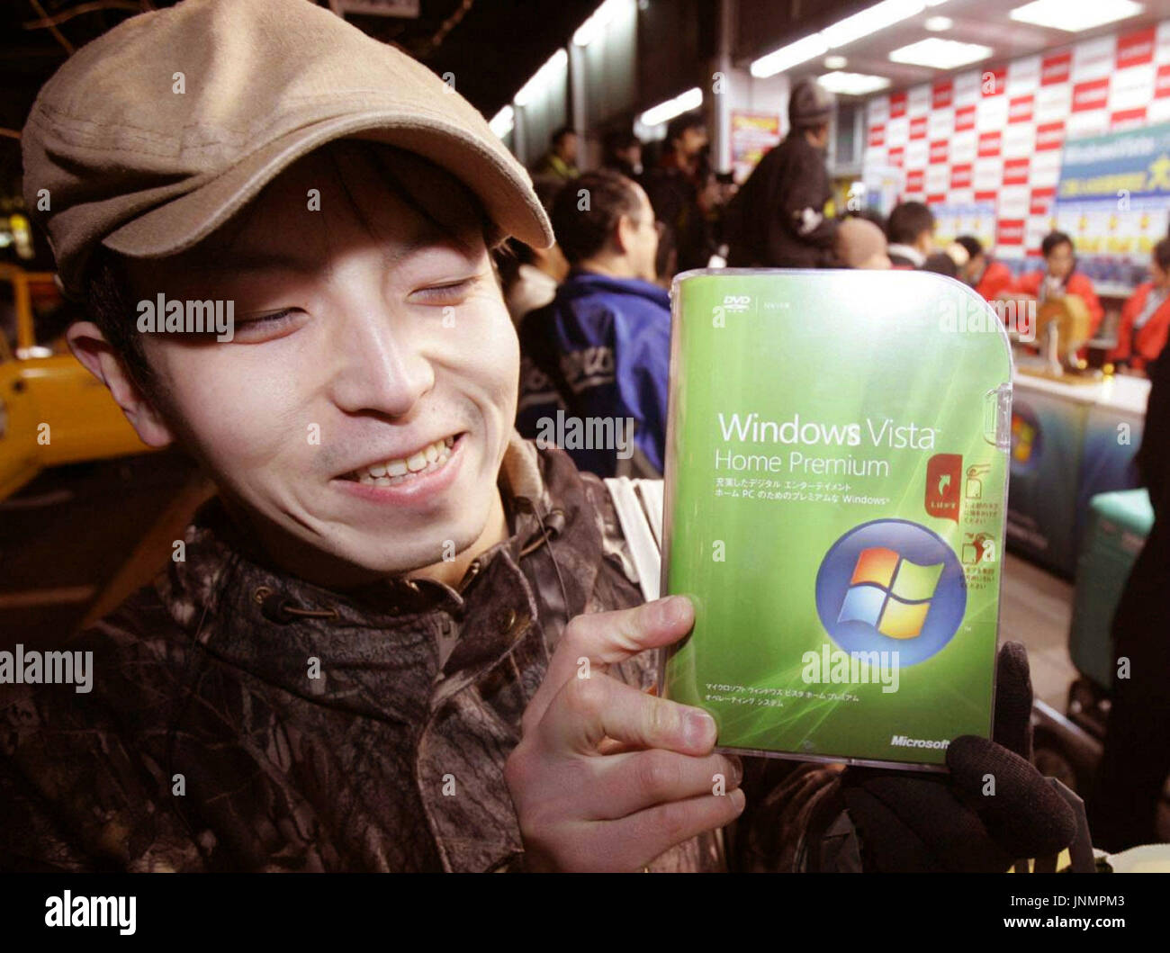 TOKYO, Japan - A man holds up Microsoft Corp's new 'Windows Vista ...