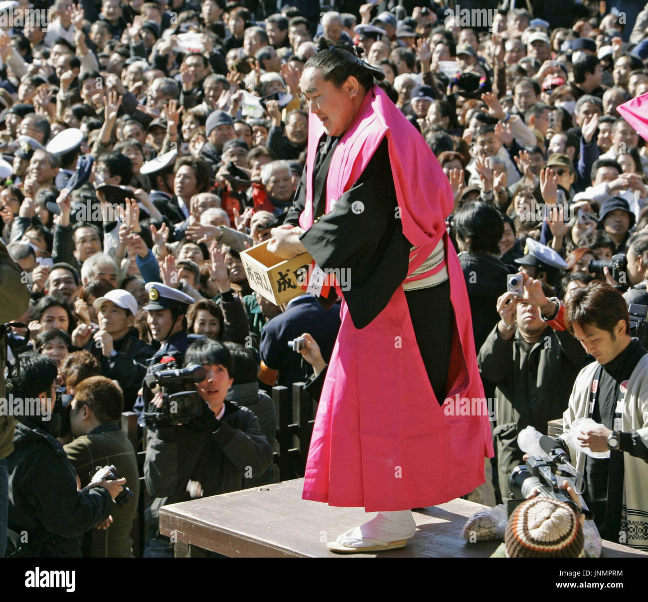 NARITA, Japan - Mongolian sumo champion Asashoryu casts beans in an ...