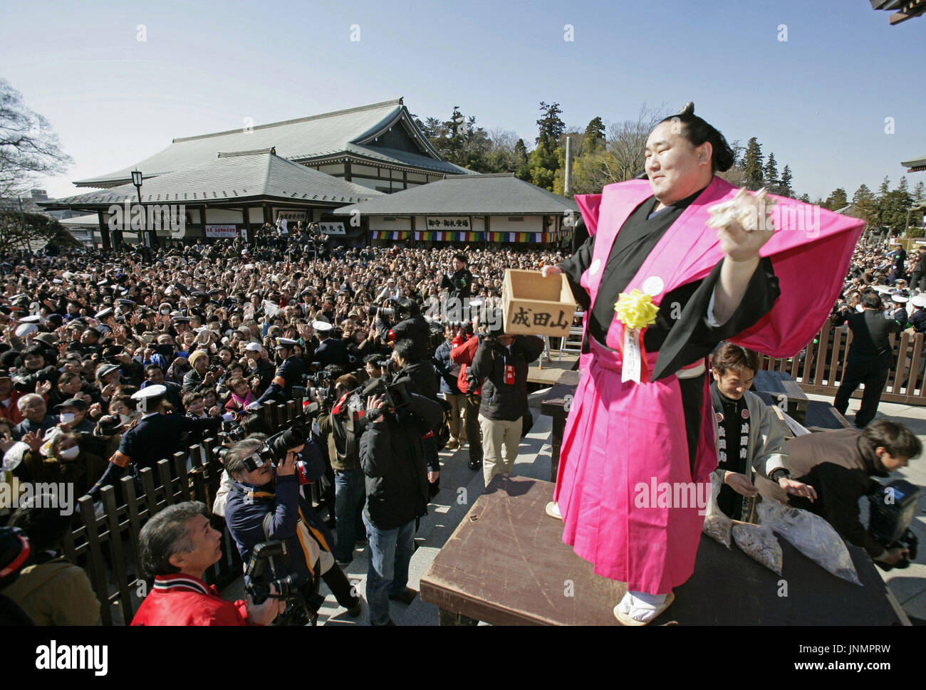 NARITA, Japan - Mongolian sumo champion Asashoryu casts beans in an ...