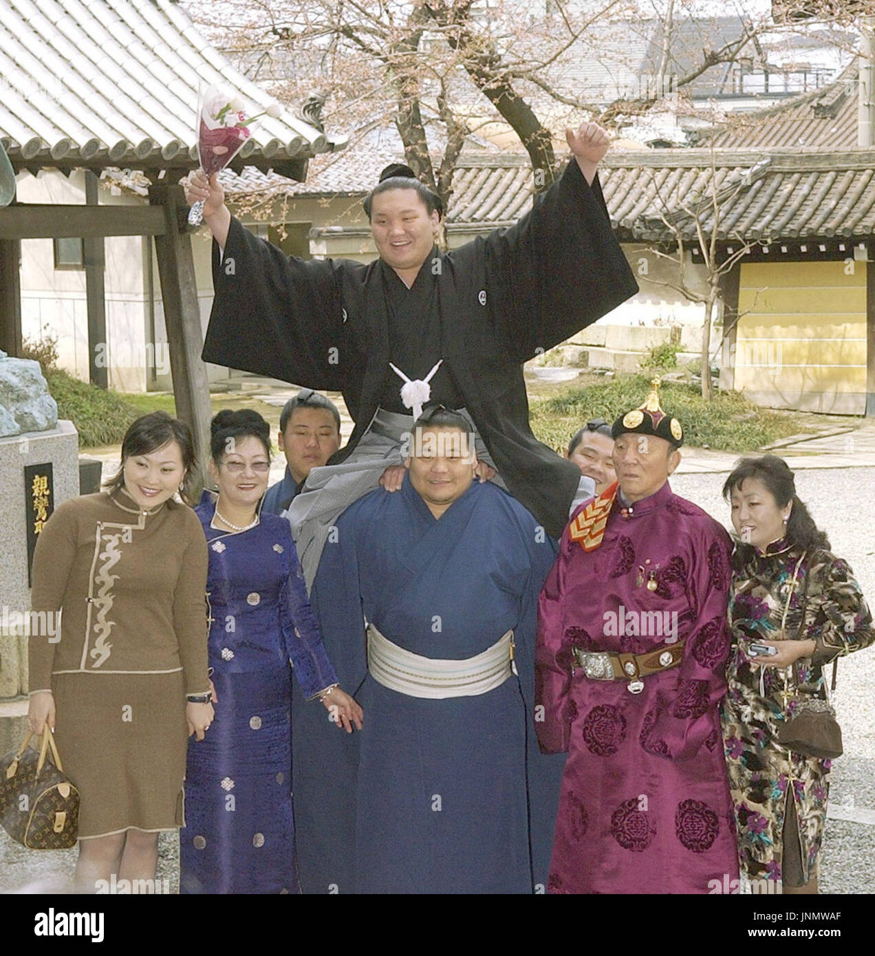 OSAKA, Japan - Mongolian Hakuho, up on a sumo wrestler's shoulders ...