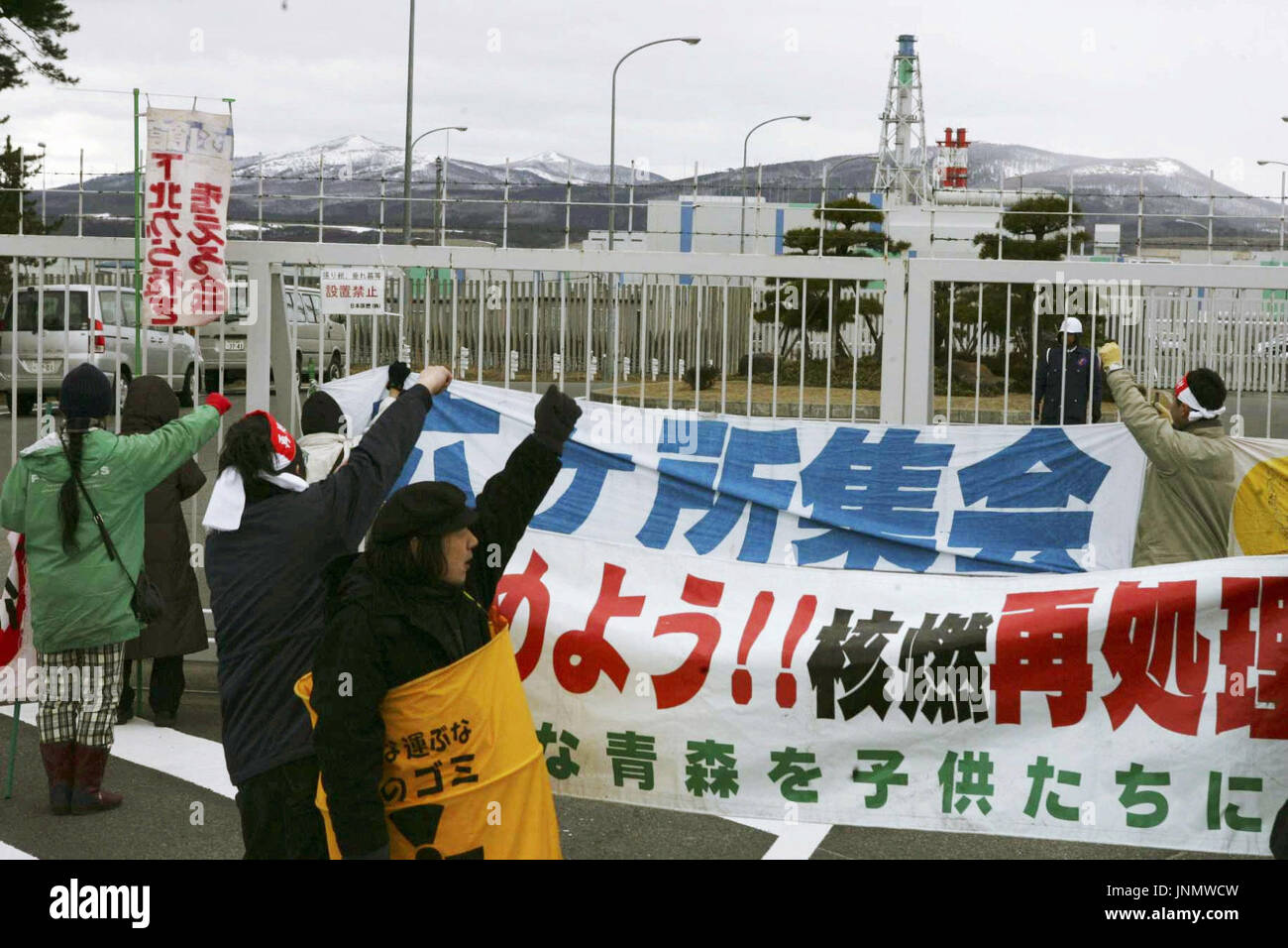 ROKKASHO, Japan - Local people rally in front of the main gate of Japan ...