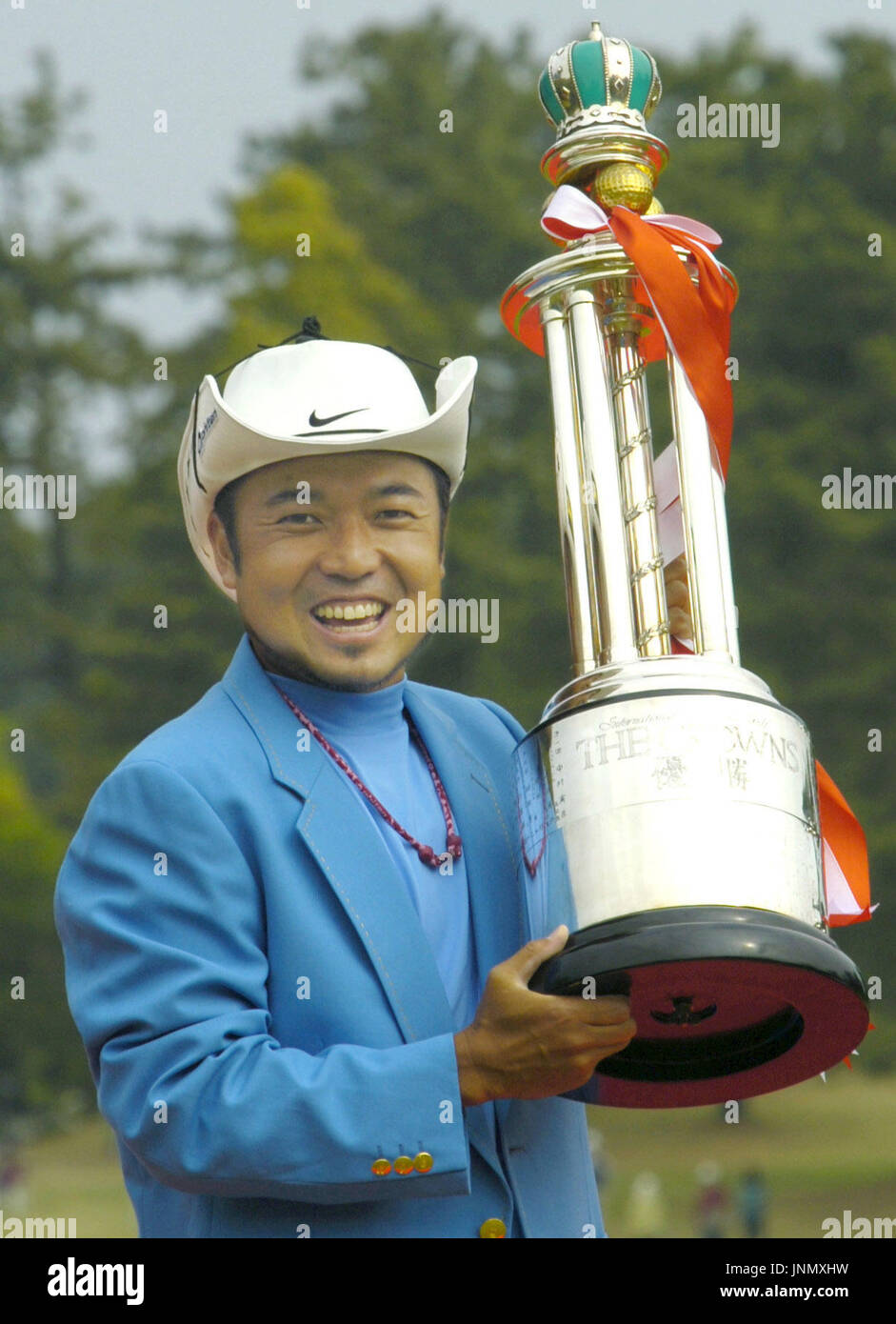 TOGO, Japan - Shingo Katayama holds up the trophy after winning the ...