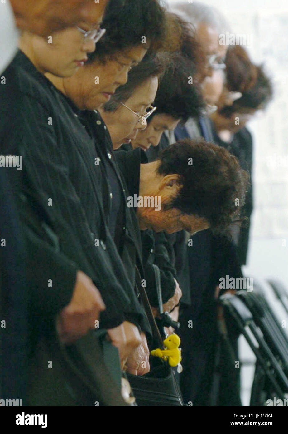 MINAMATA, Japan - People offer silent prayers for the victims of the ...
