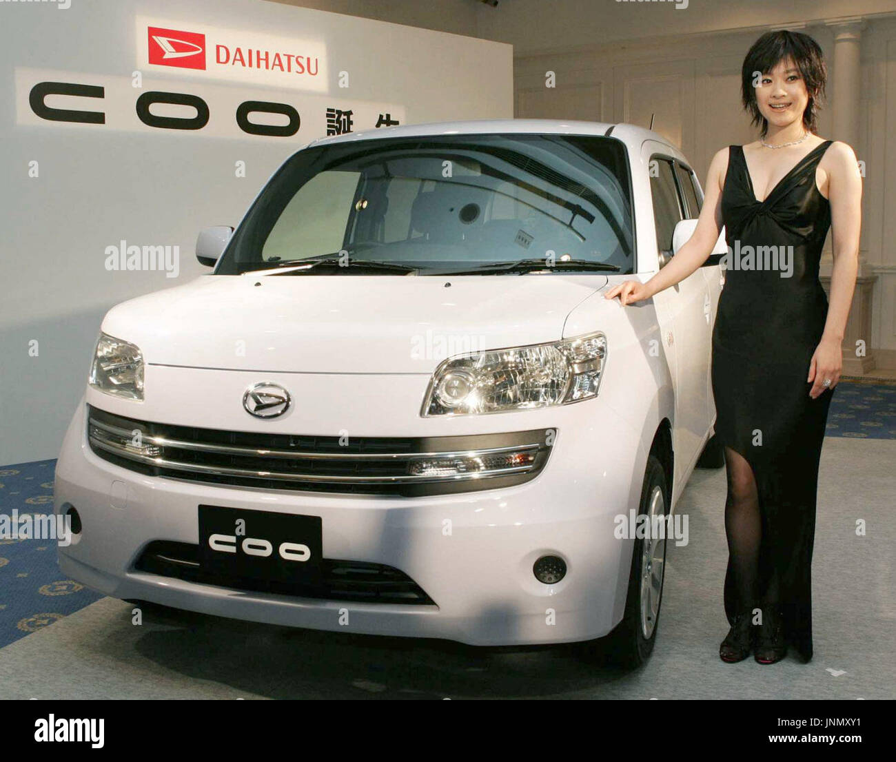 TOKYO, Japan - Actress Ryoko Shinohara stands beside Daihatsu Motor Co ...