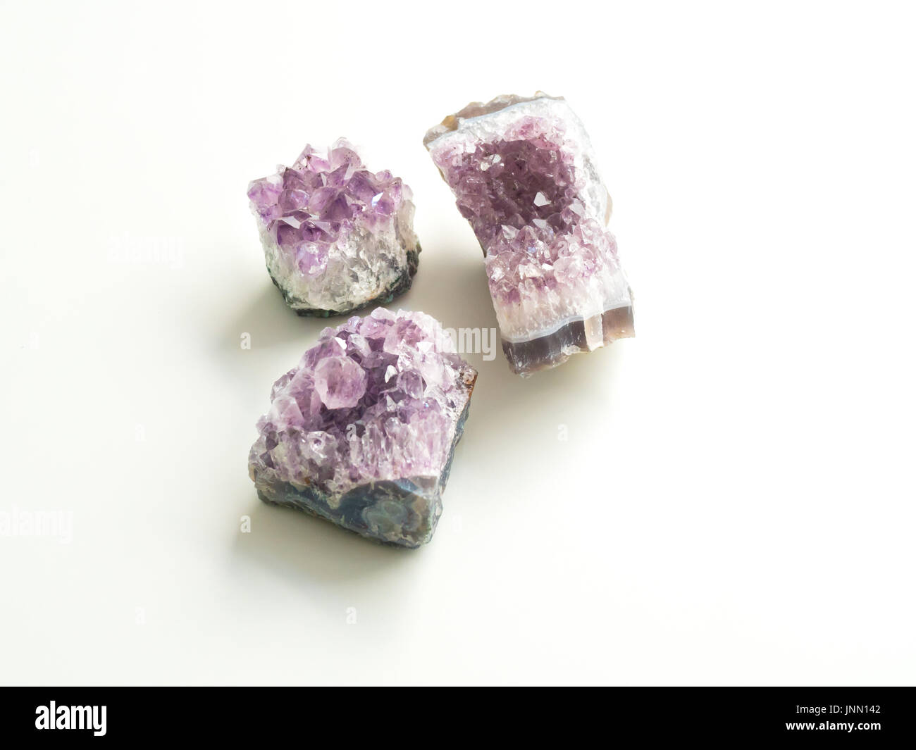 Three Amethyst geodes for crystal therapy treatments and reiki Stock ...