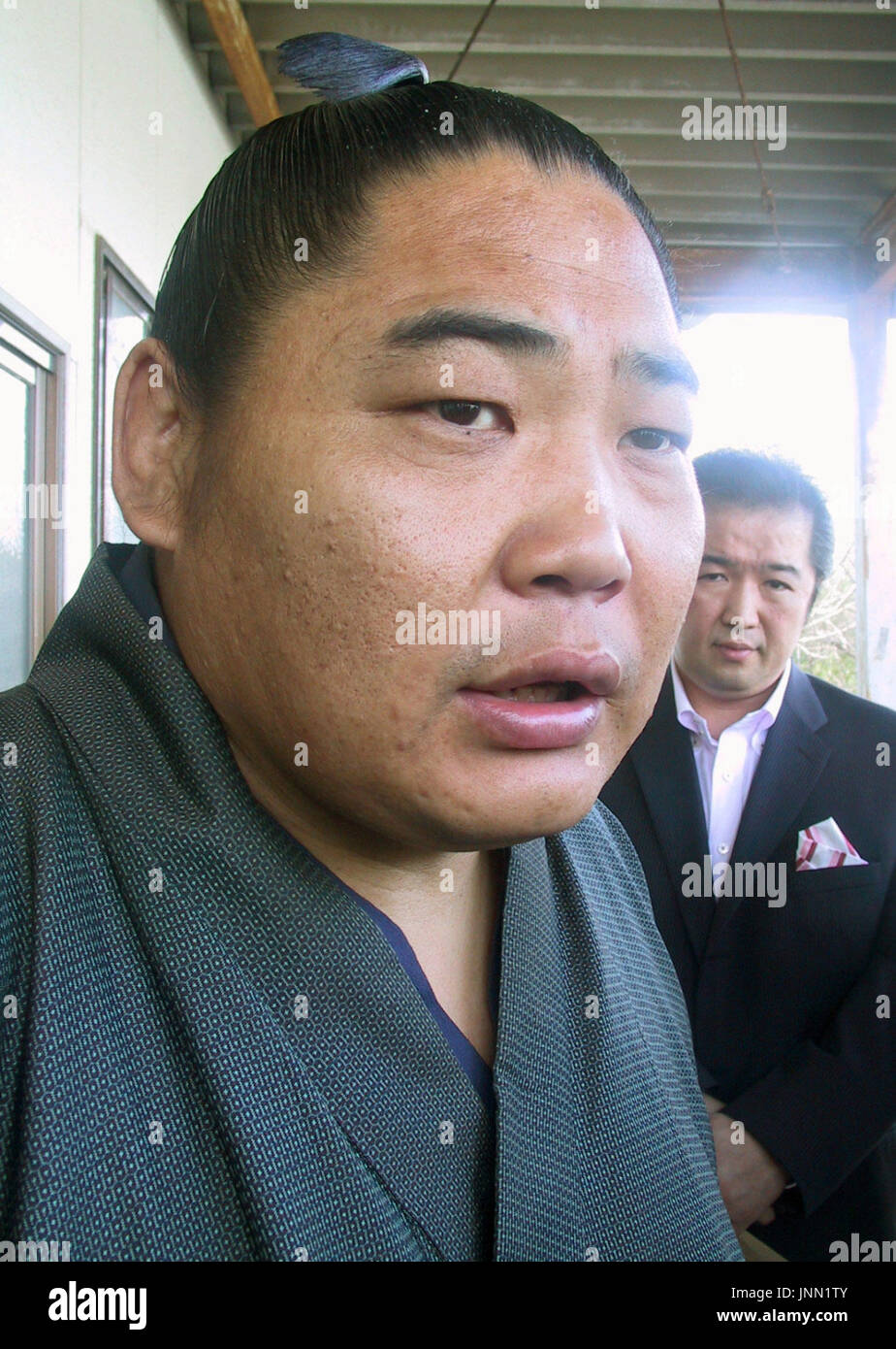 FUKUOKA, Japan - Sumo wrestler Kyokushuzan of Mongolia speaks to ...