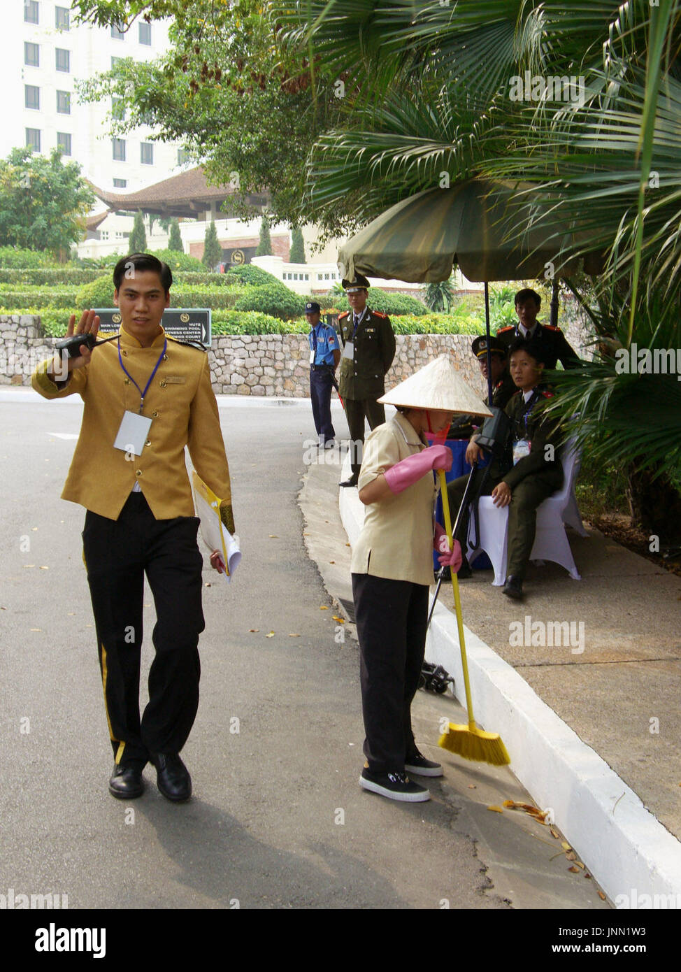 HANOI, Vietnam - A security guard and a policeman patrol on Nov. 13 ...