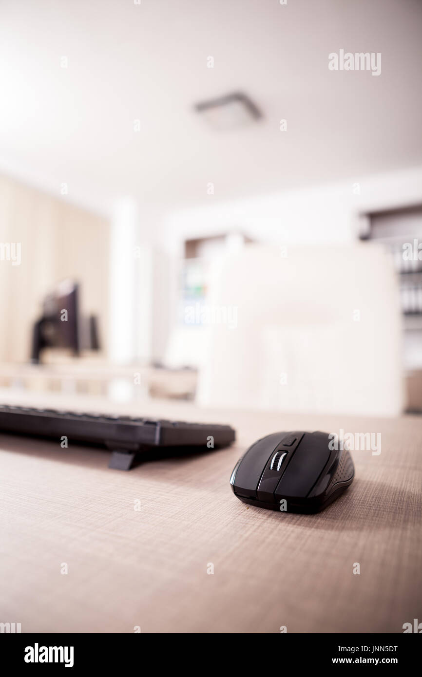 Close up on mouse and keyboard in modern empty office Stock Photo - Alamy