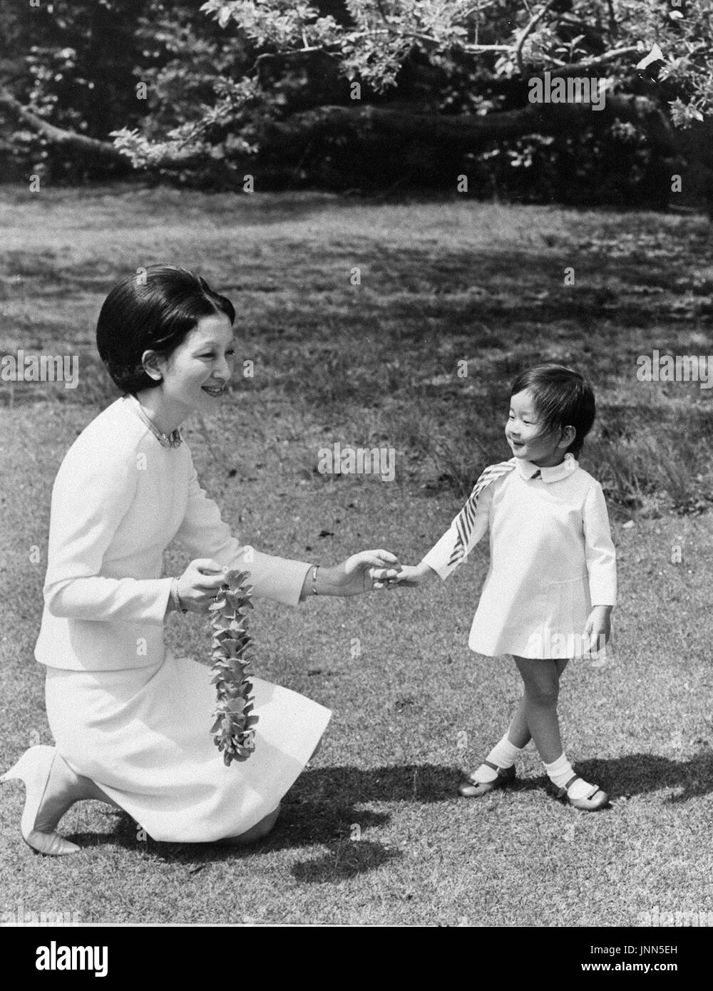 TOKYO, Japan - Crown Princess Michiko (L) plays with her daughter ...