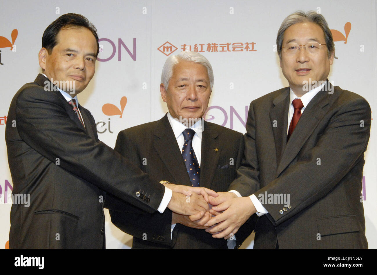 TOKYO, Japan - (From L to R) Motoya Okada, president of Japan's major ...