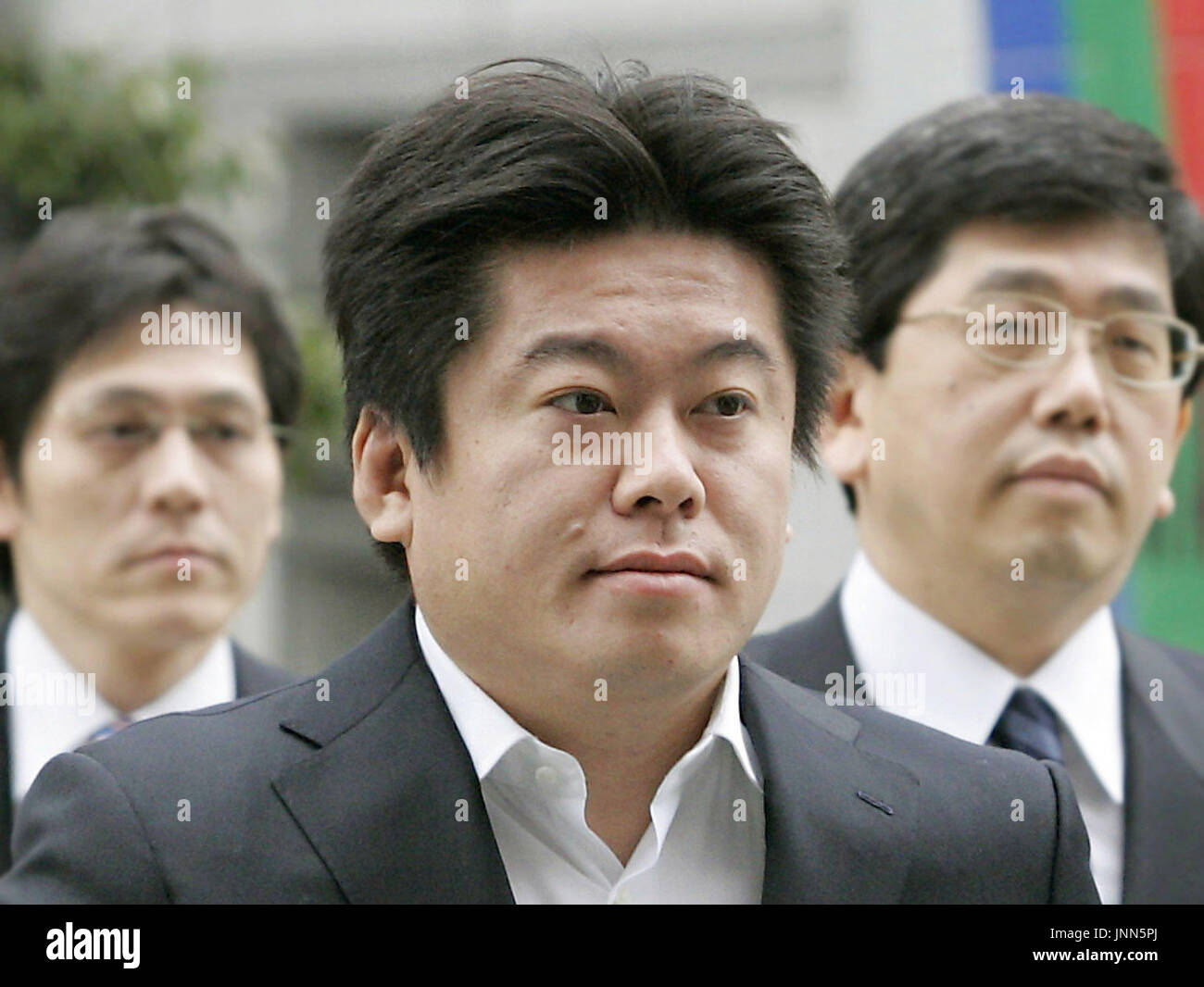 TOKYO, Japan - Takafumi Horie (C), Livedoor Co. group founder, enters ...