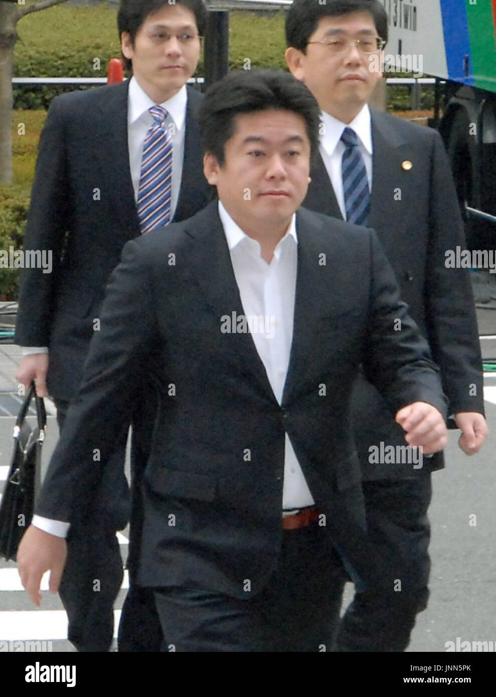 TOKYO, Japan - Takafumi Horie (front), Livedoor Co. group founder ...