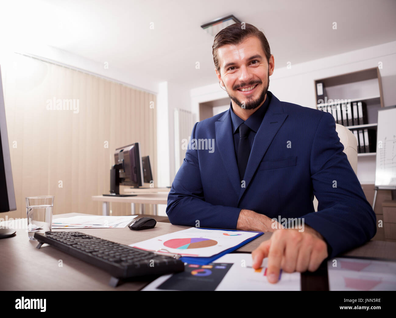 Busy Businessman in suit in his office Stock Photo - Alamy