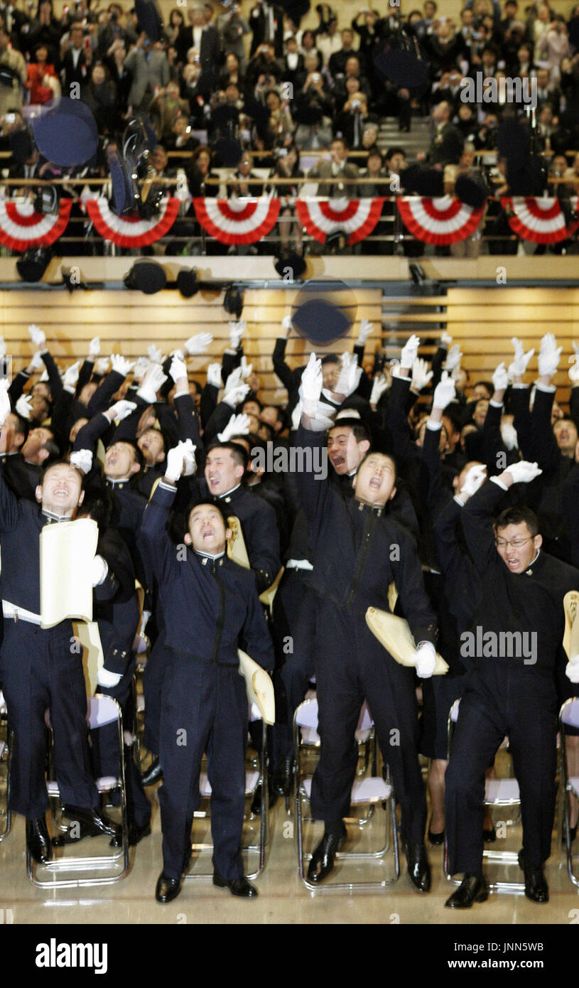YOKOSUKA, Japan - Graduates of the National Defense Academy toss their ...