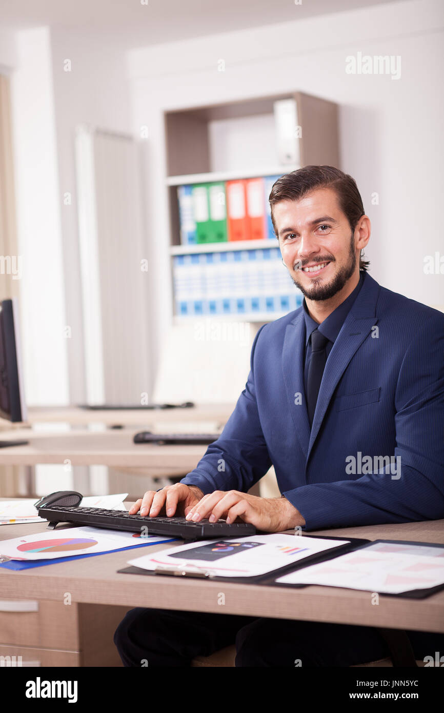Beautiful Businessman in suit in his office Stock Photo - Alamy