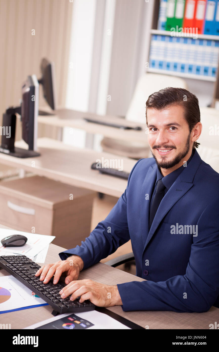 Beautiful Businessman in suit in his office Stock Photo - Alamy
