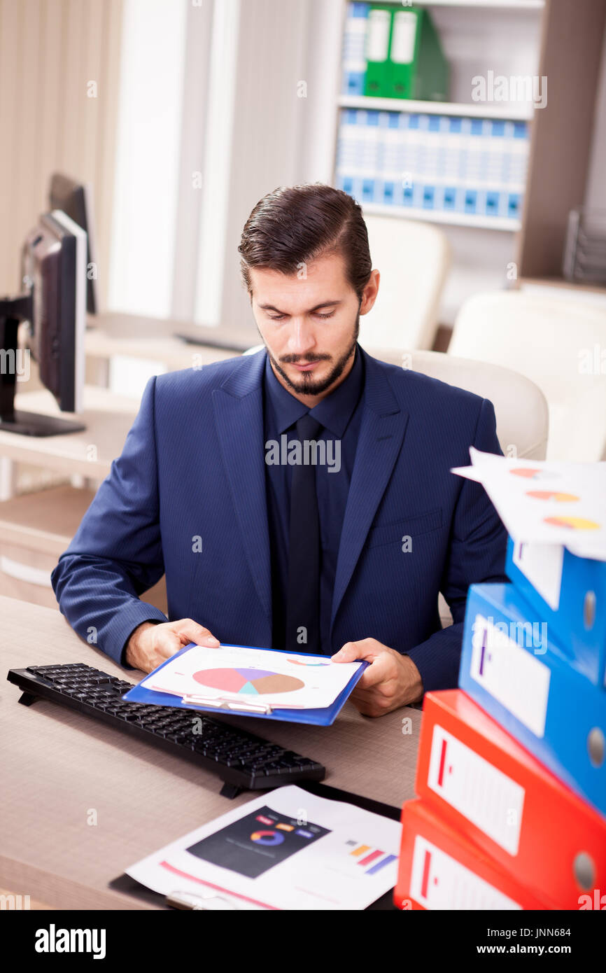 Busy corporate worker depressed from the workload Stock Photo - Alamy