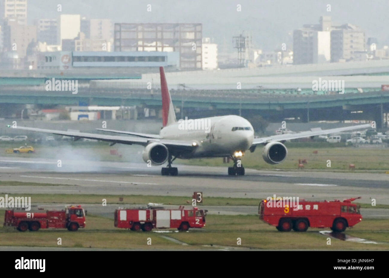 TOKYO, Japan - A Japan Airlines Boeing 777 jetliner makes an emergency ...
